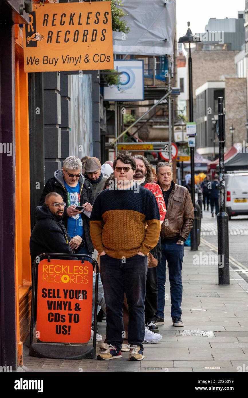 London, UK. 20 April 2024. Customers queue outside Reckless Records in ...