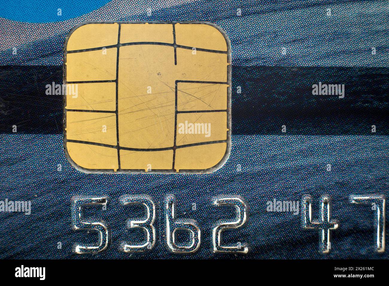 Generic credit card close-up detail with numbers and scratched chip ...