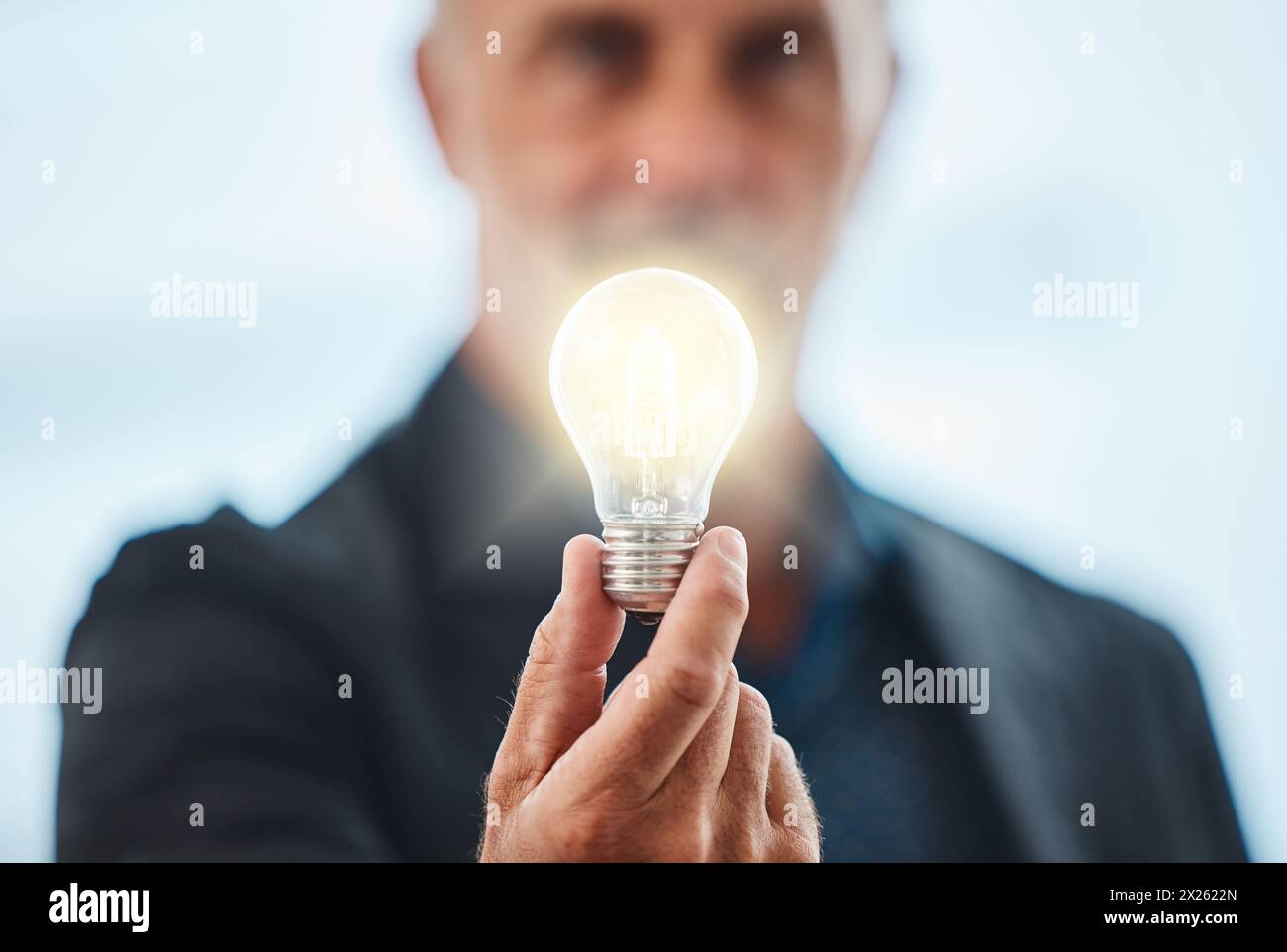 Business, man and hand with light for vision, innovation and creative ...