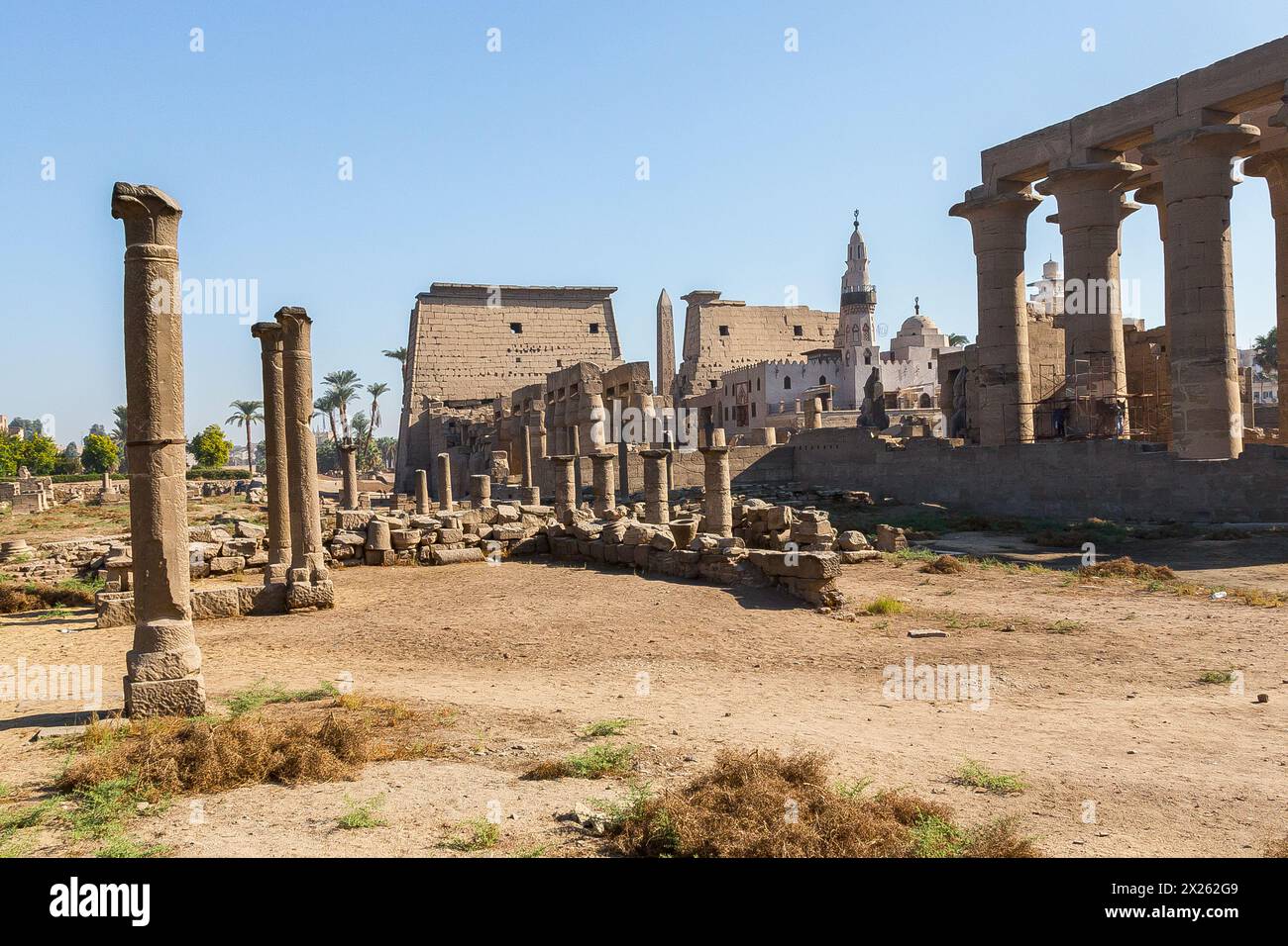 Egypt, Luxor temple, first pylon, obelisk and Abu el Haggag mosque ...