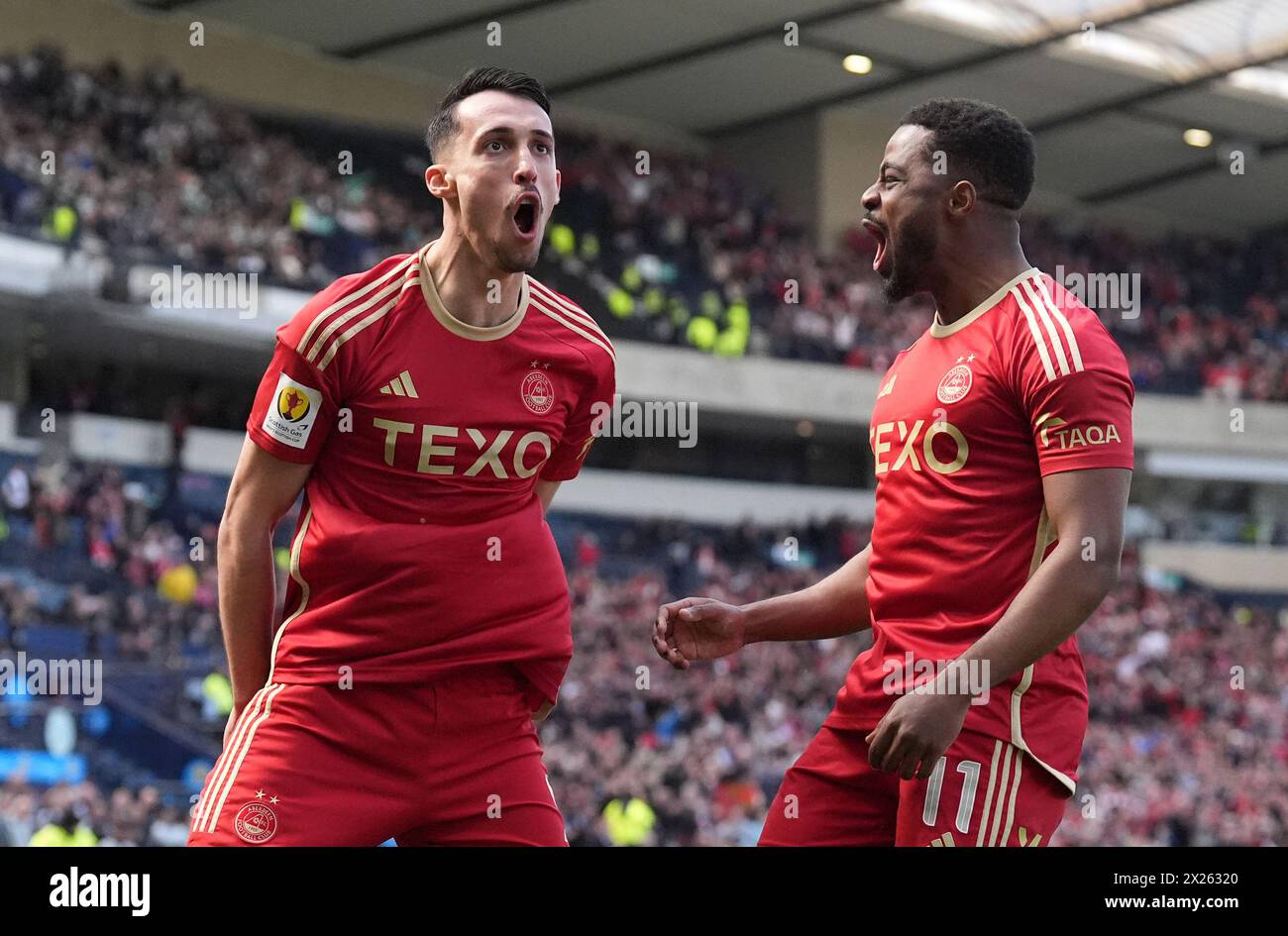 Aberdeen's Bojan Miovski (left) celebrates with Duk after scoring their ...