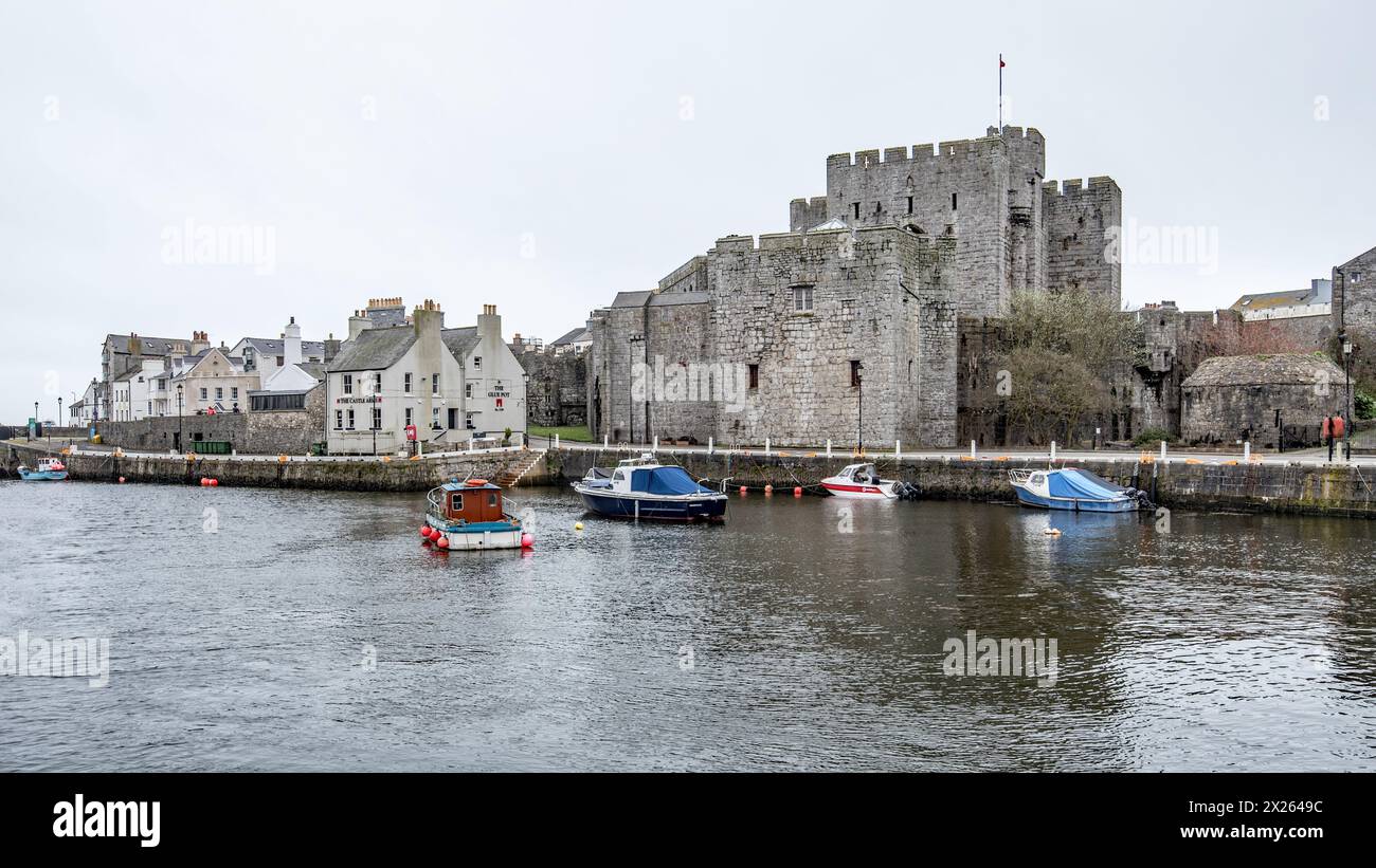 The walls of Rushen Castle overlooking the tidal harbour area in ...