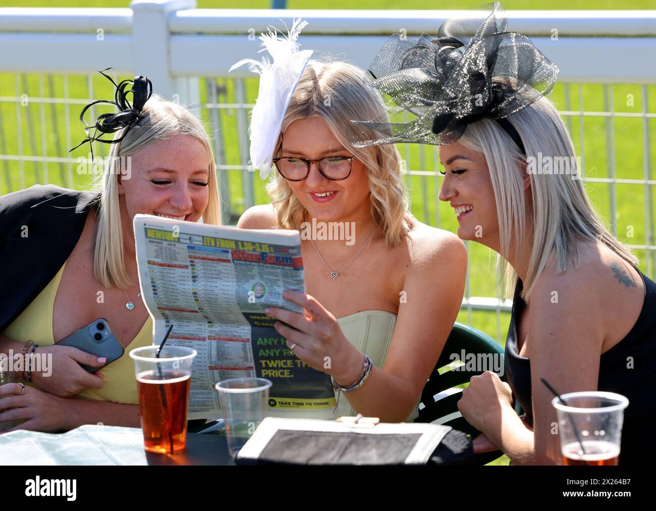A general view of racegoers enjoying the weather before the Coral ...