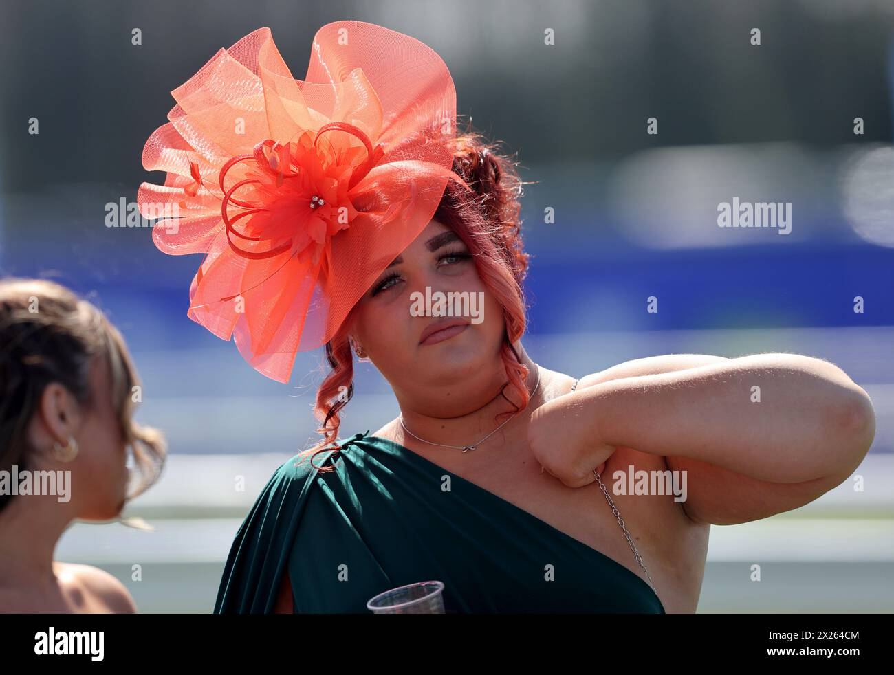 A general view of a racegoer enjoying the weather before the Coral ...