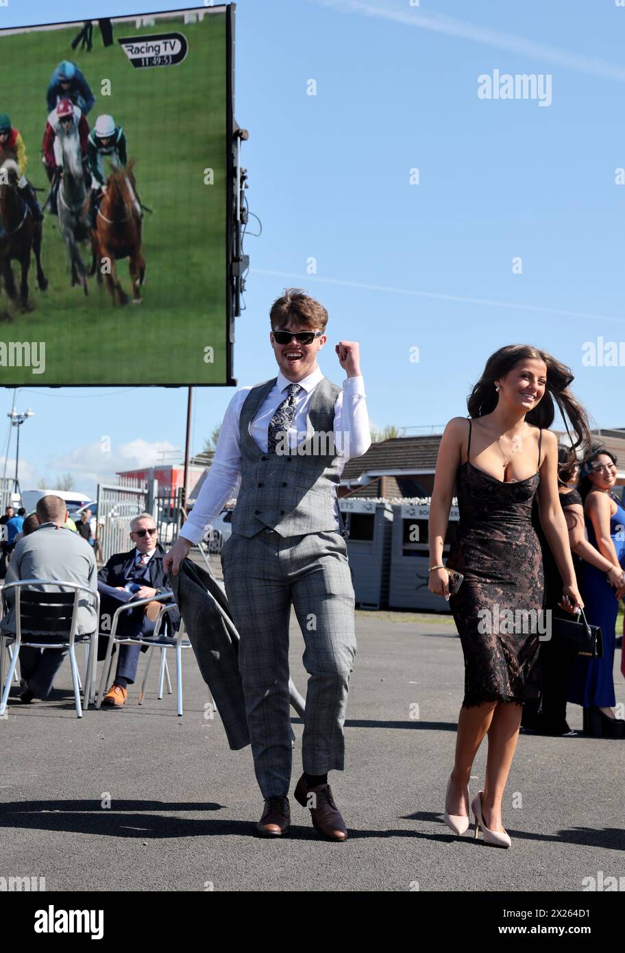A general view of racegoers arriving before the Coral Scottish Grand ...