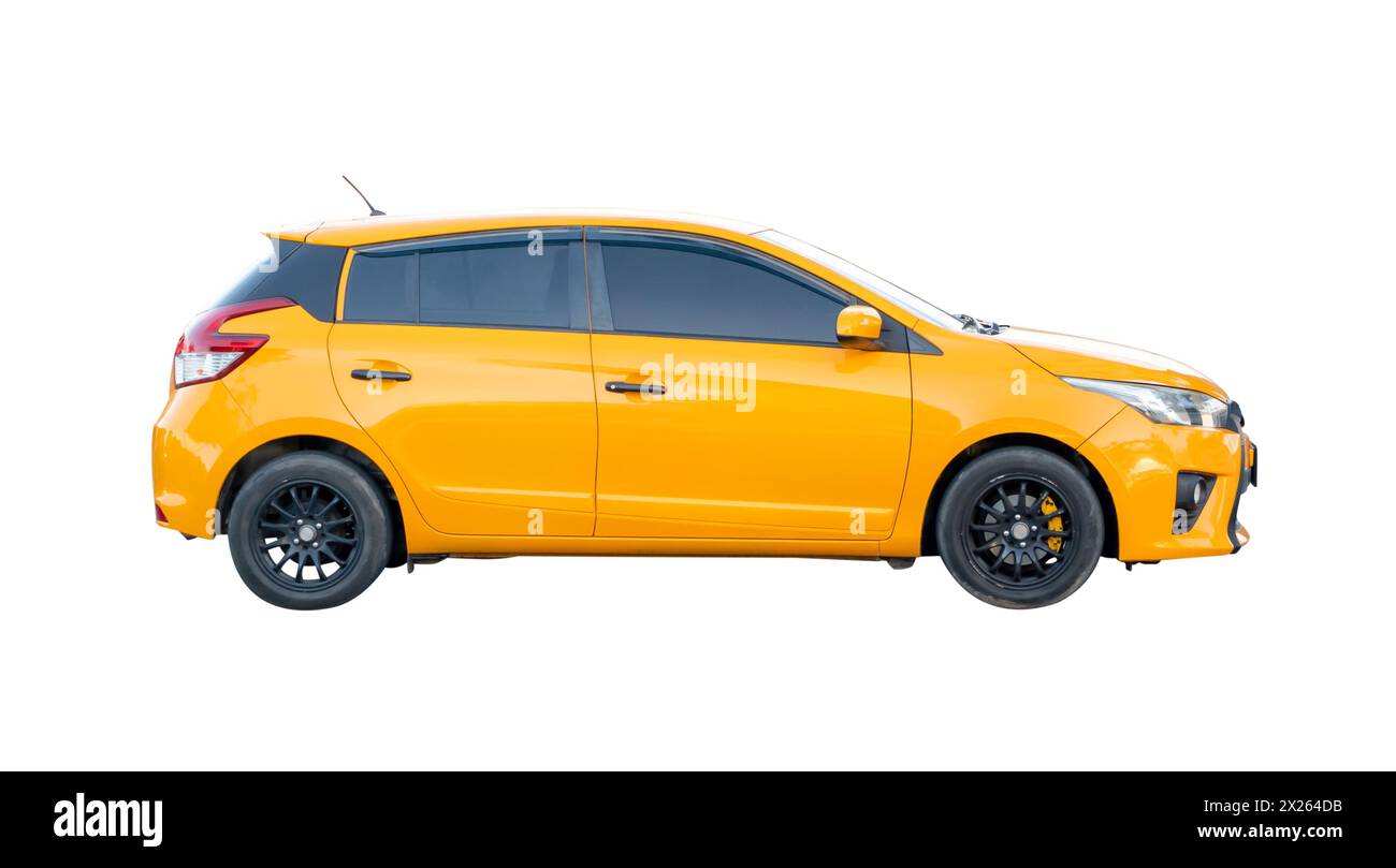 Side view of yellow hatchback car is isolated on white background with ...