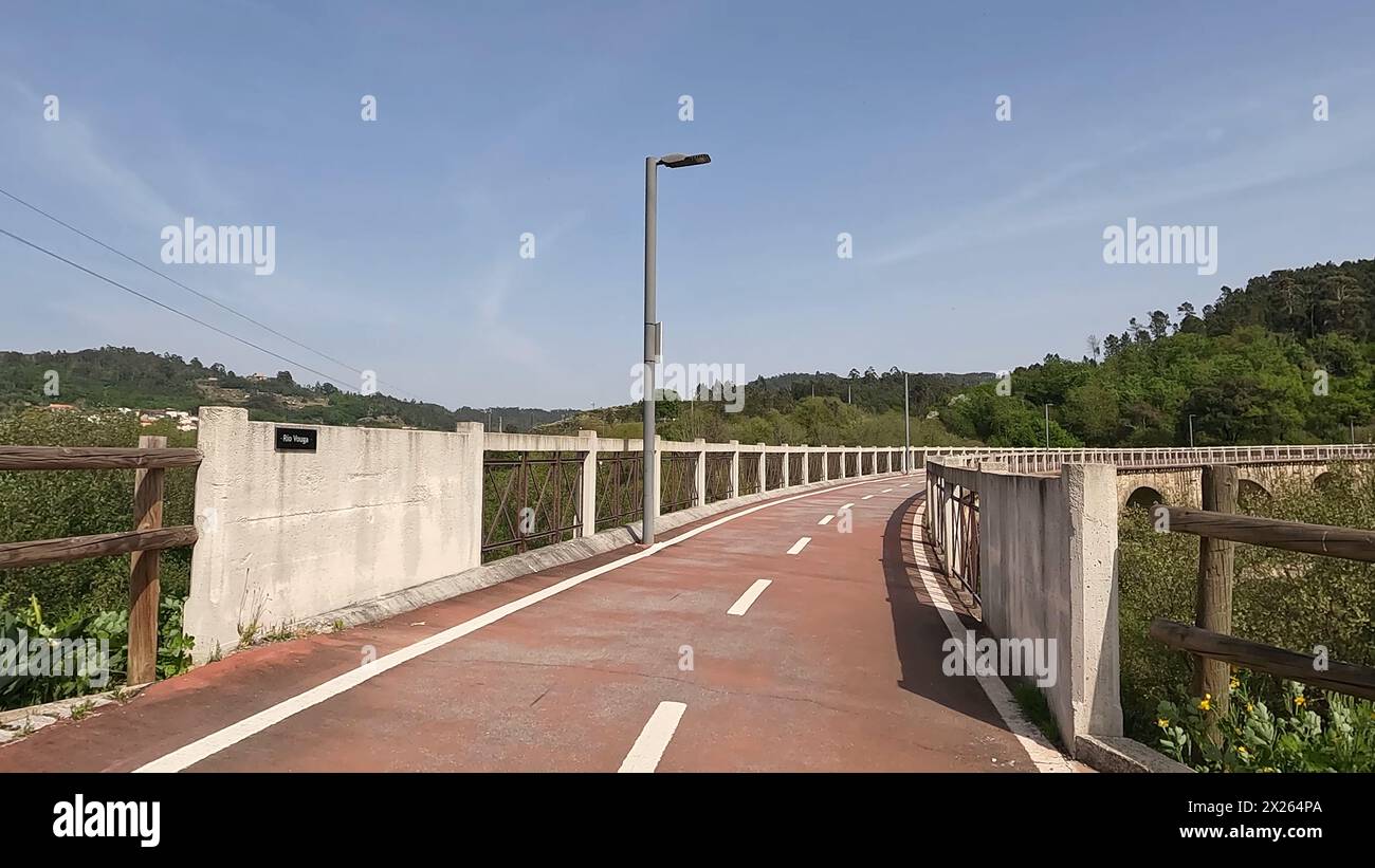 Point of view shot of riding a bicycle in Vouzela, Portugal. Features a wide view of the bike ...