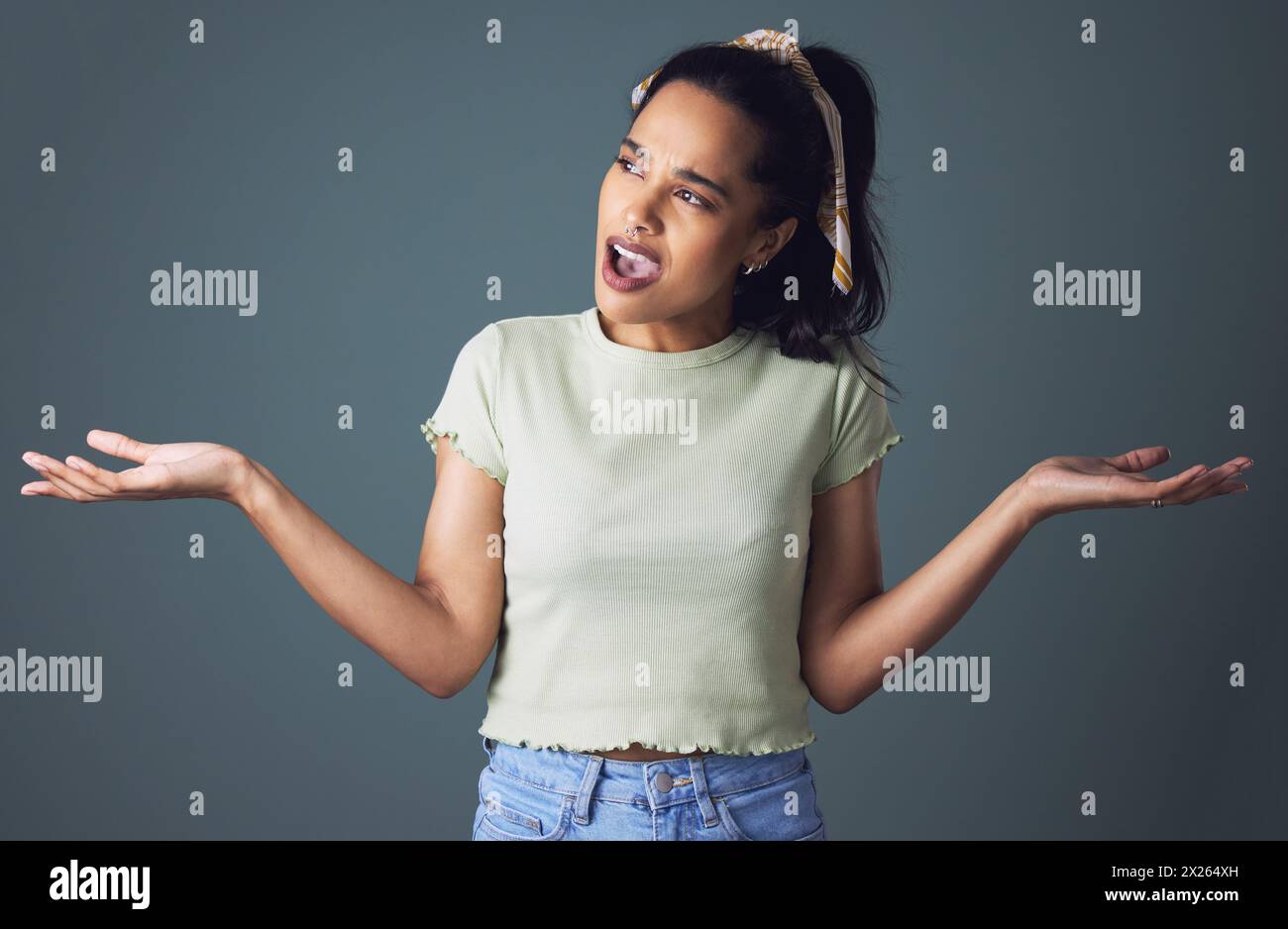 Girl, fashion and confused as gen z in studio on grey background in ...