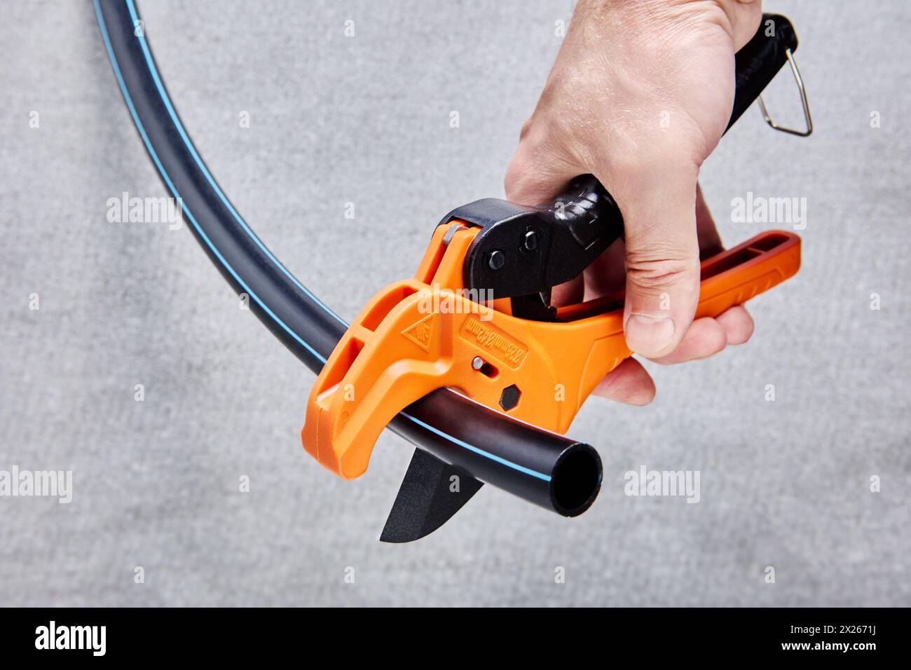 Ratcheting plastic pipe and tube cutter for one hand operation Stock ...