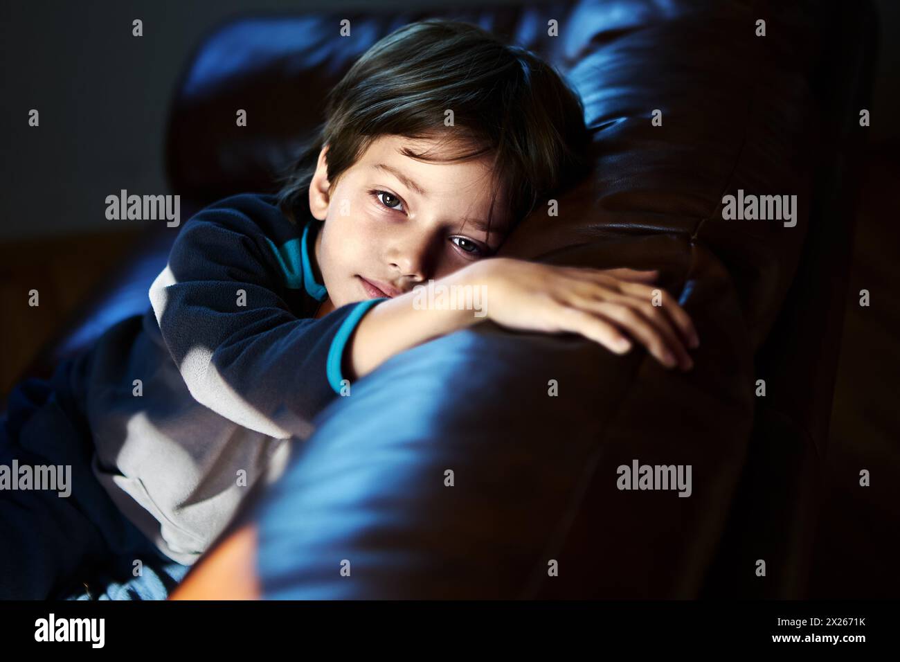 Bored little boy 7 years old alone in room Stock Photo - Alamy