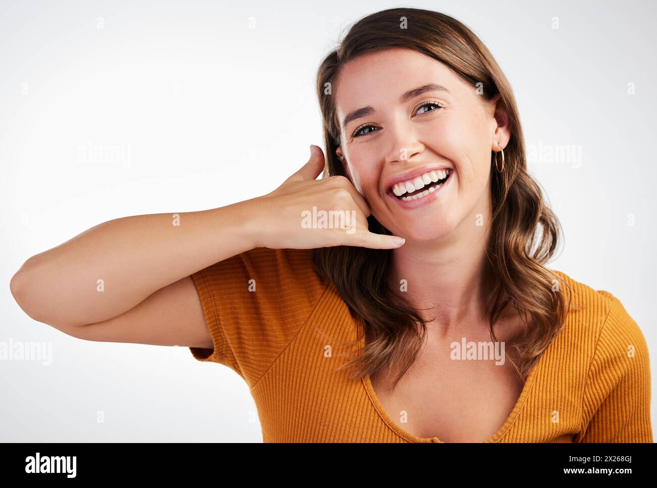 Studio, call me sign and woman with hand gesture on face, smile and ...