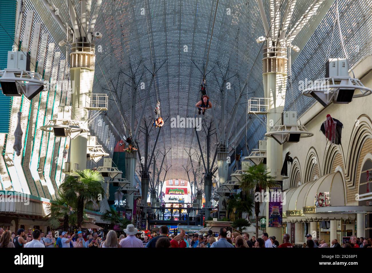 Las Vegas, Nevada. Fremont Street. Three Zoomline Riders Fly above the ...