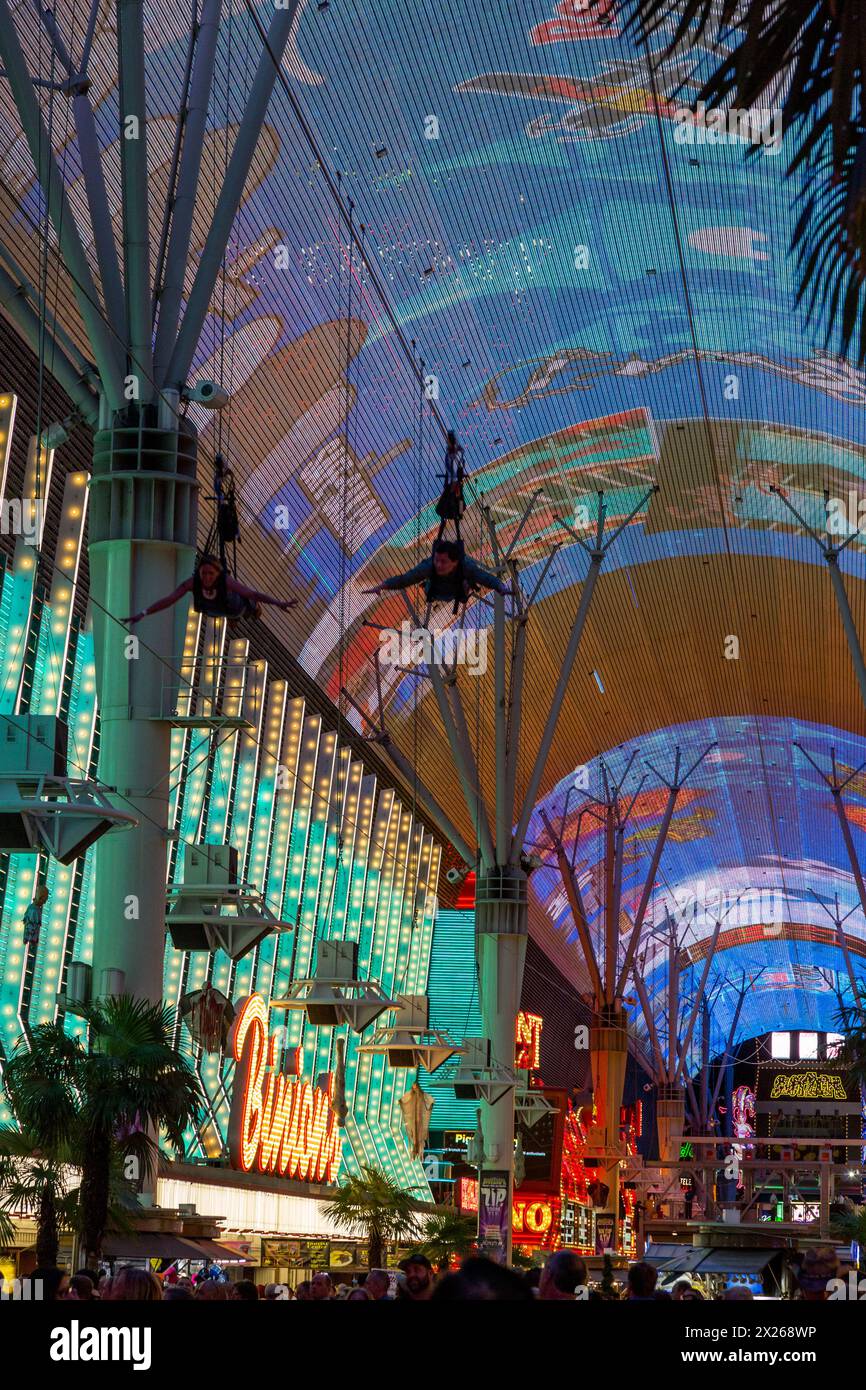 Las Vegas, Nevada. Fremont Street. Two Zip Line Riders on the Zoomline ...