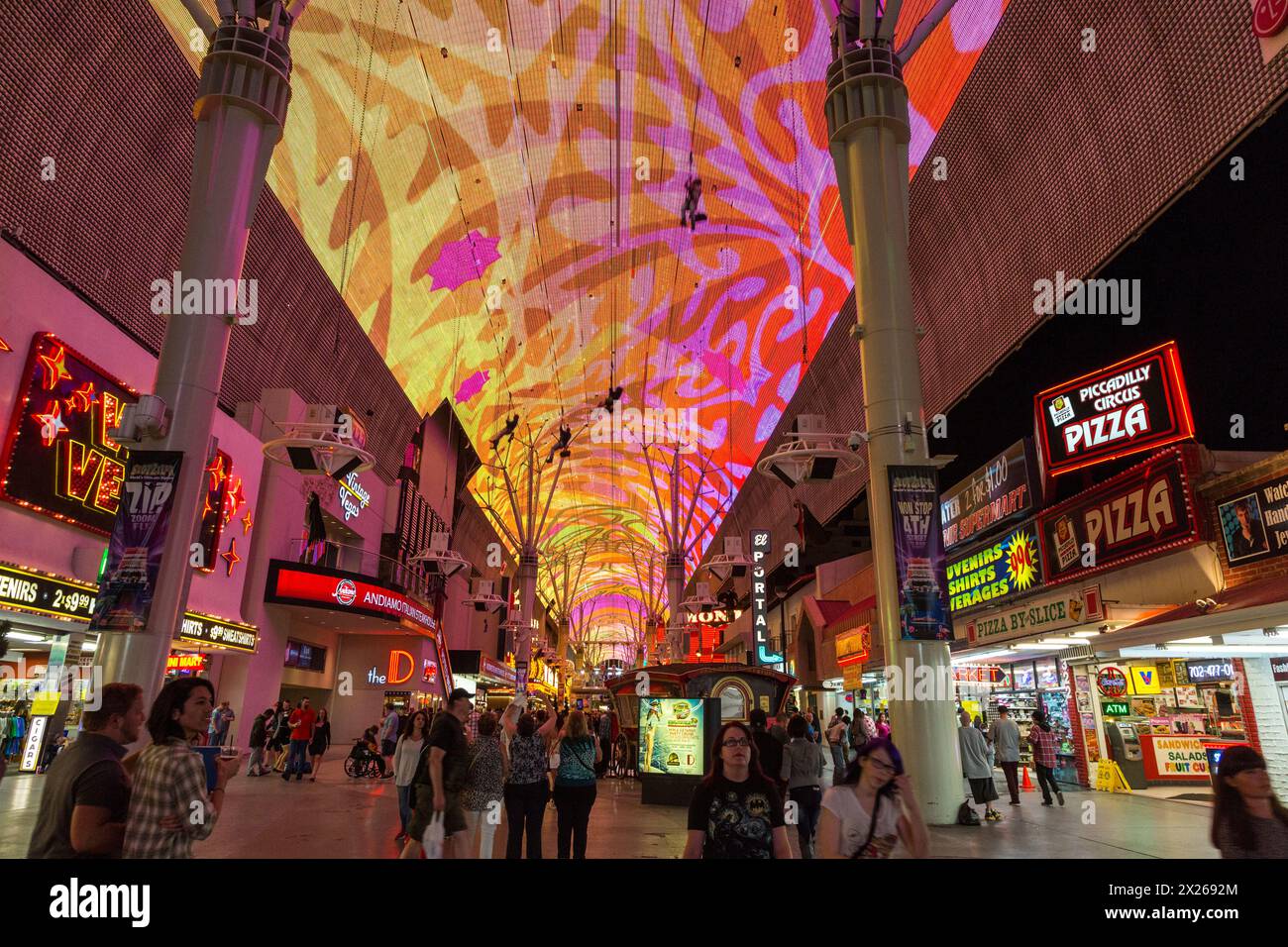 Las Vegas, Nevada. Fremont Street Experience. Four Zipline Riders above ...
