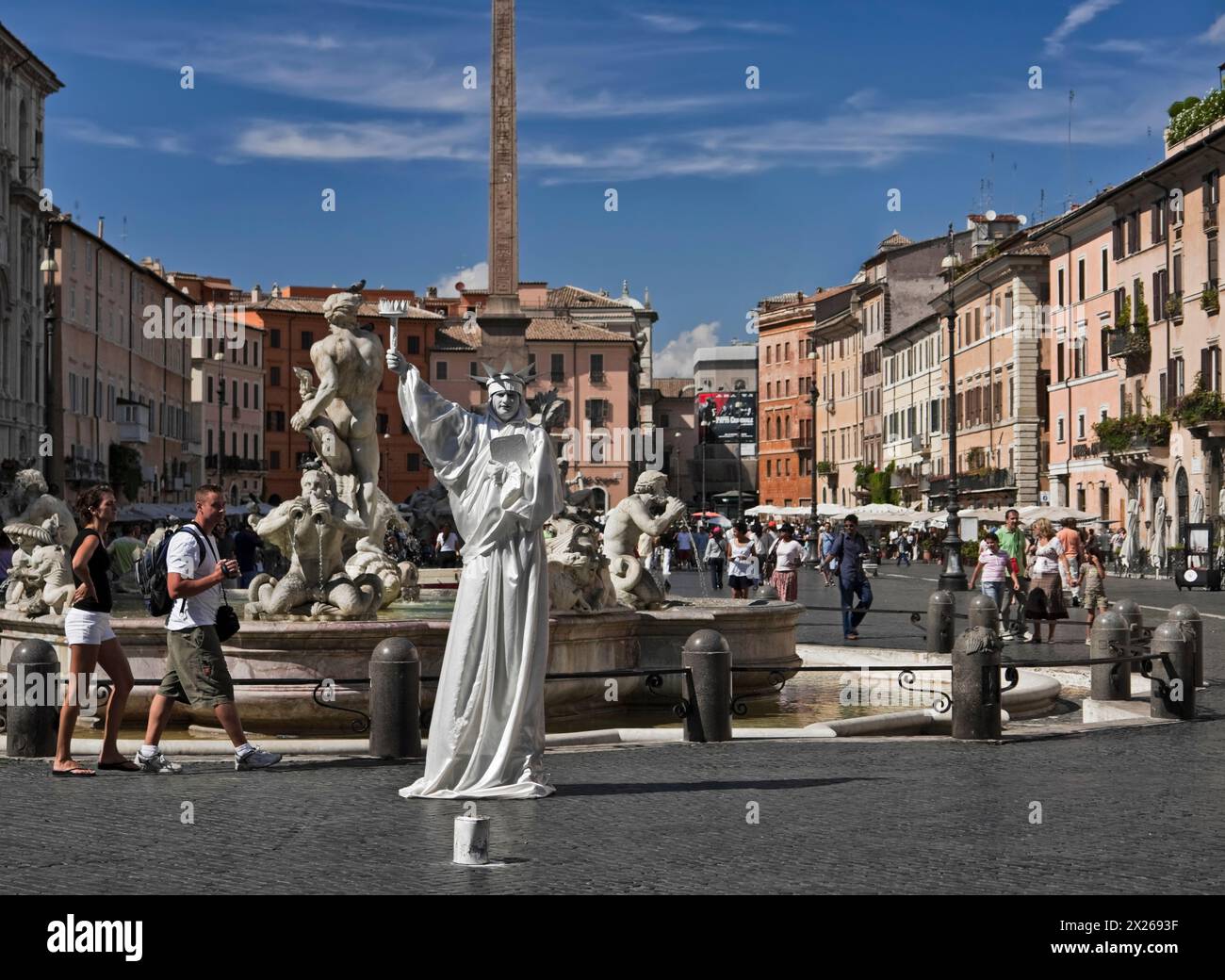 ITALY, Lazio, Rome, Navona square, a mime simulates the statue of ...