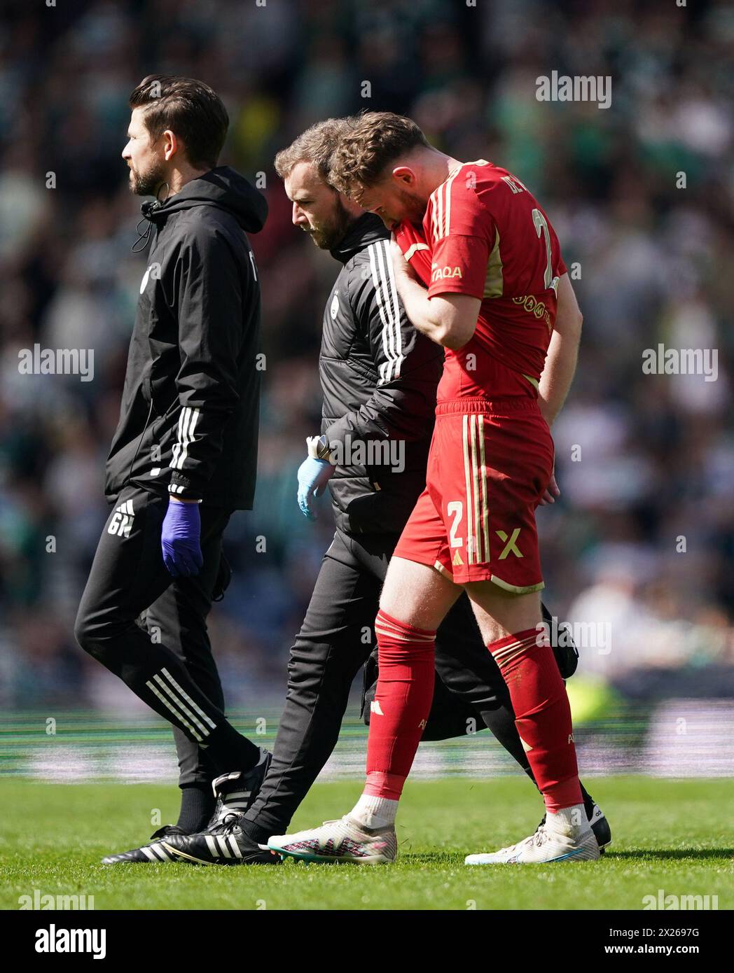 Aberdeen's Nicky Devlin leaves the game with an injury during the ...