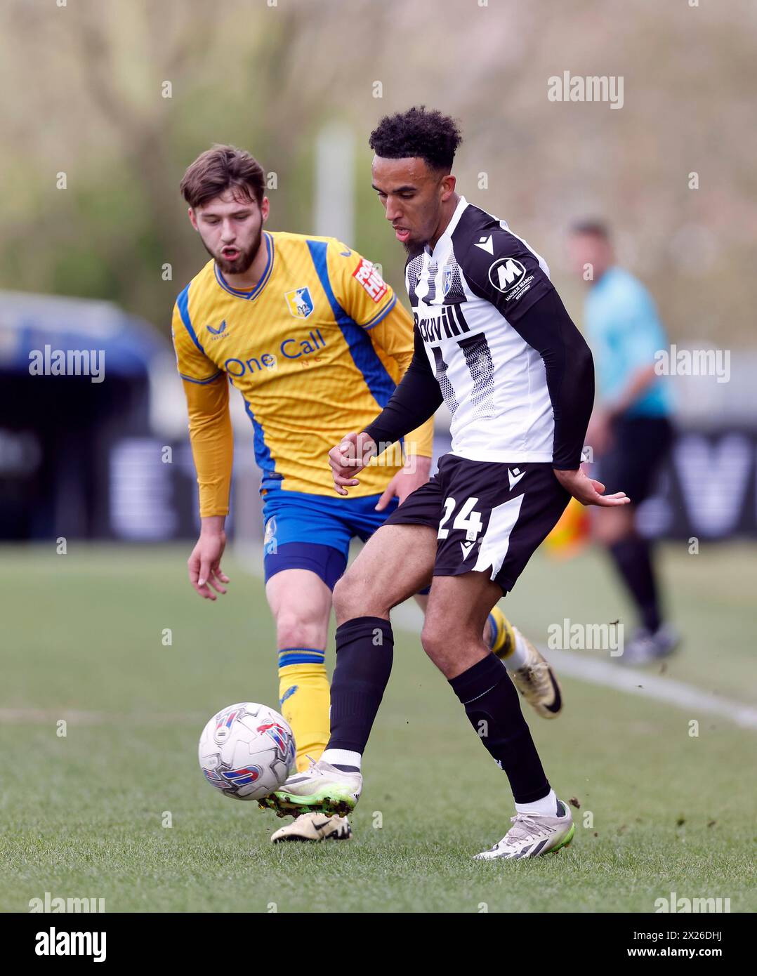 Mansfield Town's James Gale and Gillingham's Remeao Hutton (right ...