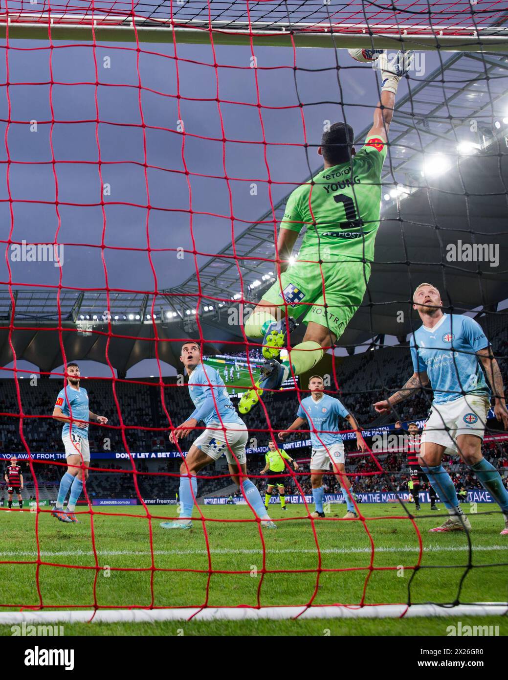 Goalkeeper, Jamie Young of Melbourne City jumps to push the ball away ...