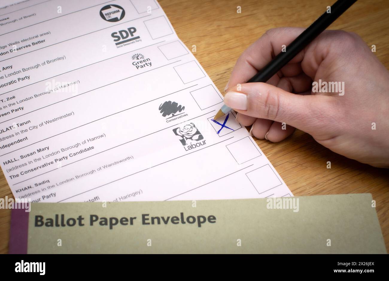 London , United Kingdom , 20.04.2024 , Completing a postal vote ballot ...