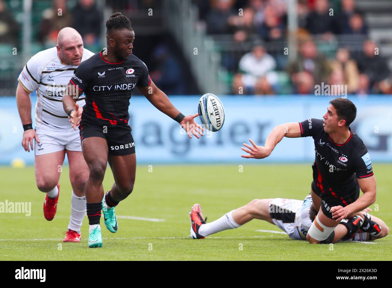 Saracens' Juan Martin Gonzalez passes to Saracens' Rotimi Segun (left ...