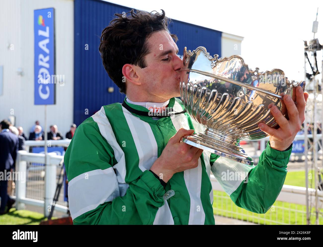 Jockey Danny Mullins kisses the trophy after he rode Macdermott ridden ...