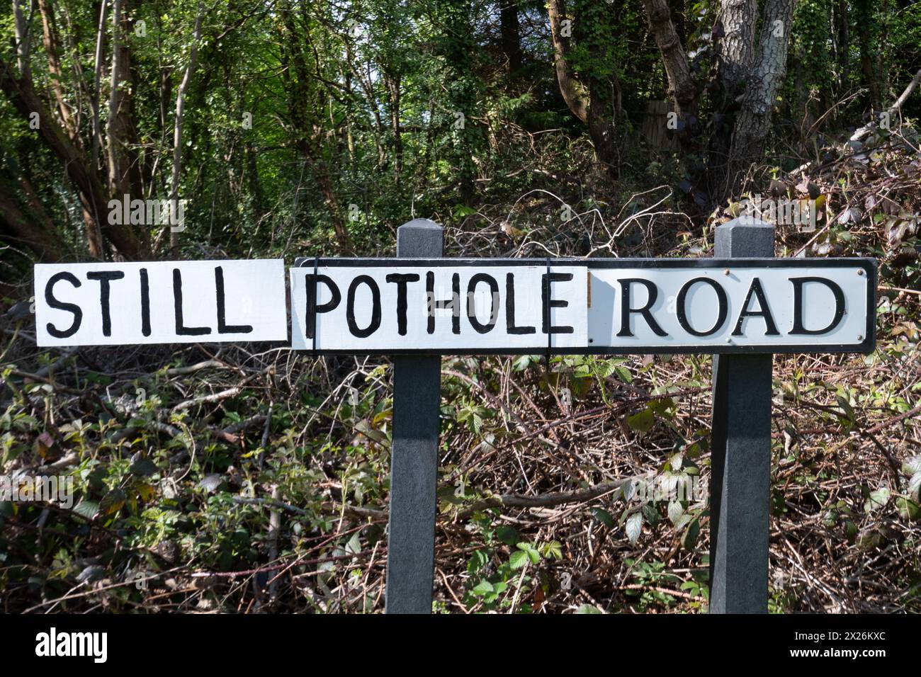 Road sign with actual street name replaced by the words Still Pothole ...