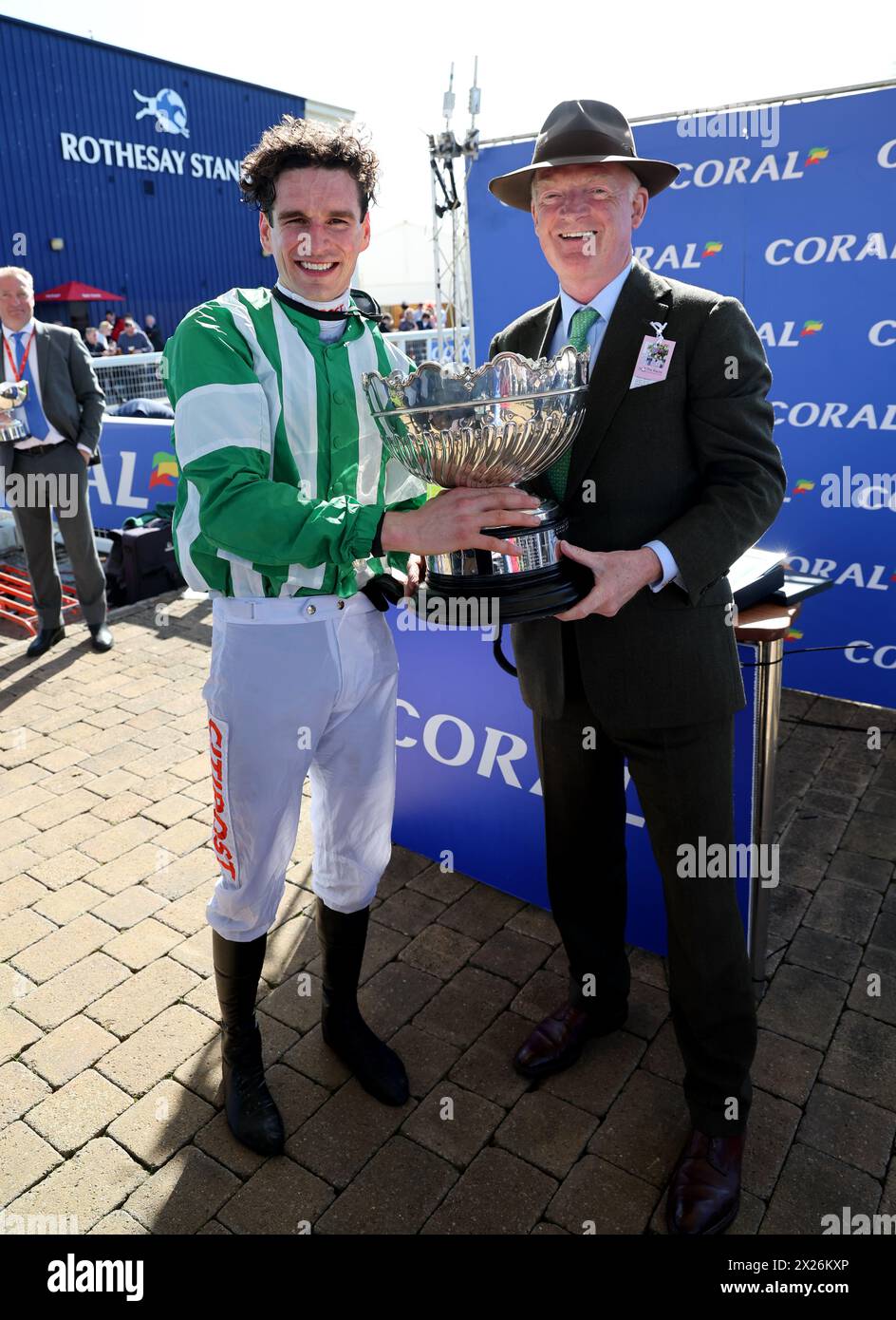 Jockey Danny Mullins and trainer Willie Mullins with the trophy after ...
