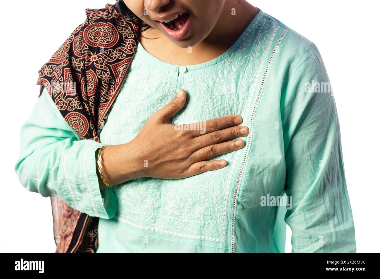 An Indian woman holding her chest for pain showing painful expression ...