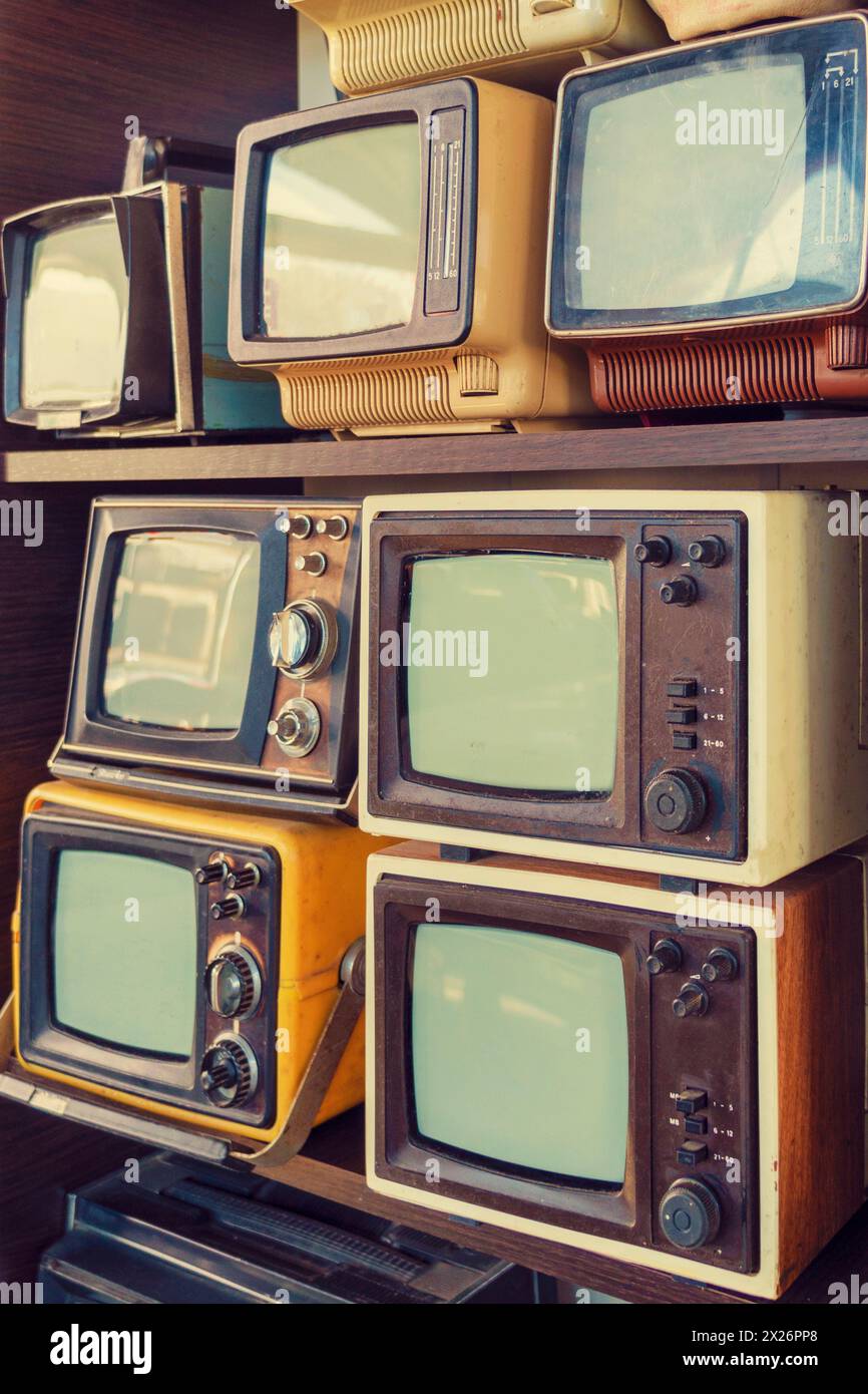 Many retro television. vintage old TV is colorful multi-row. Seeing the ...