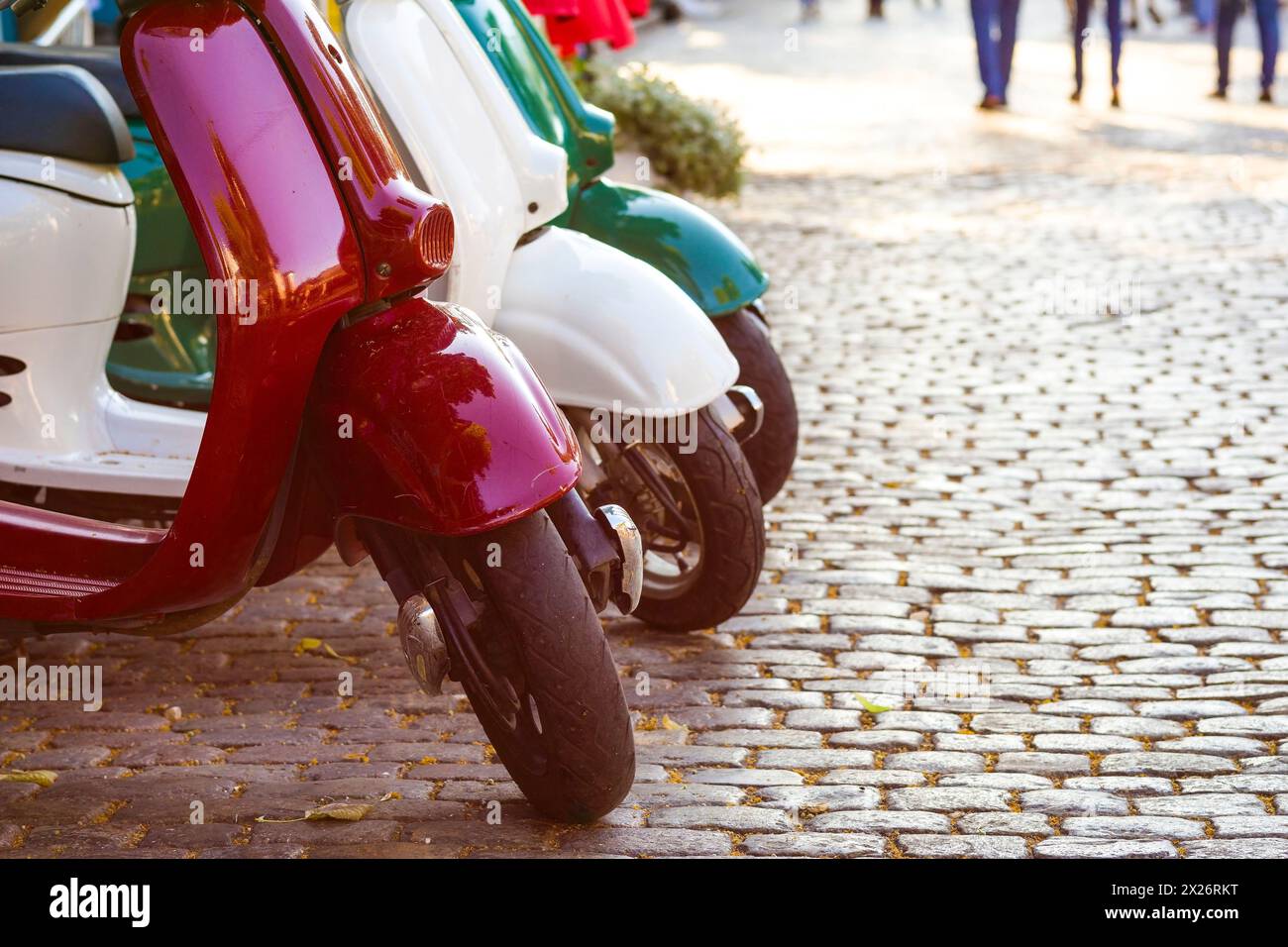 Italian style vintage scooter parked on sidewalk.Vintage scooters on a ...