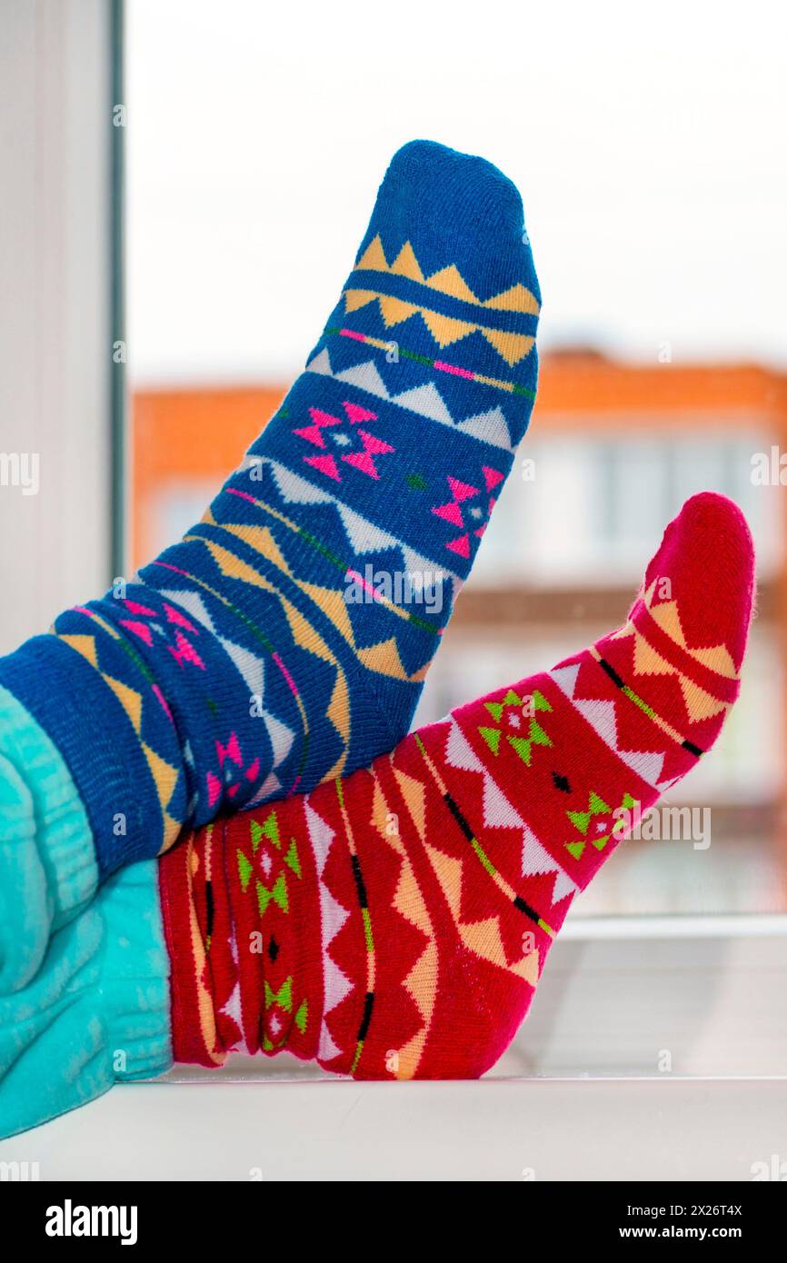 Women's legs in different beautiful socks. Colored socks on a ...