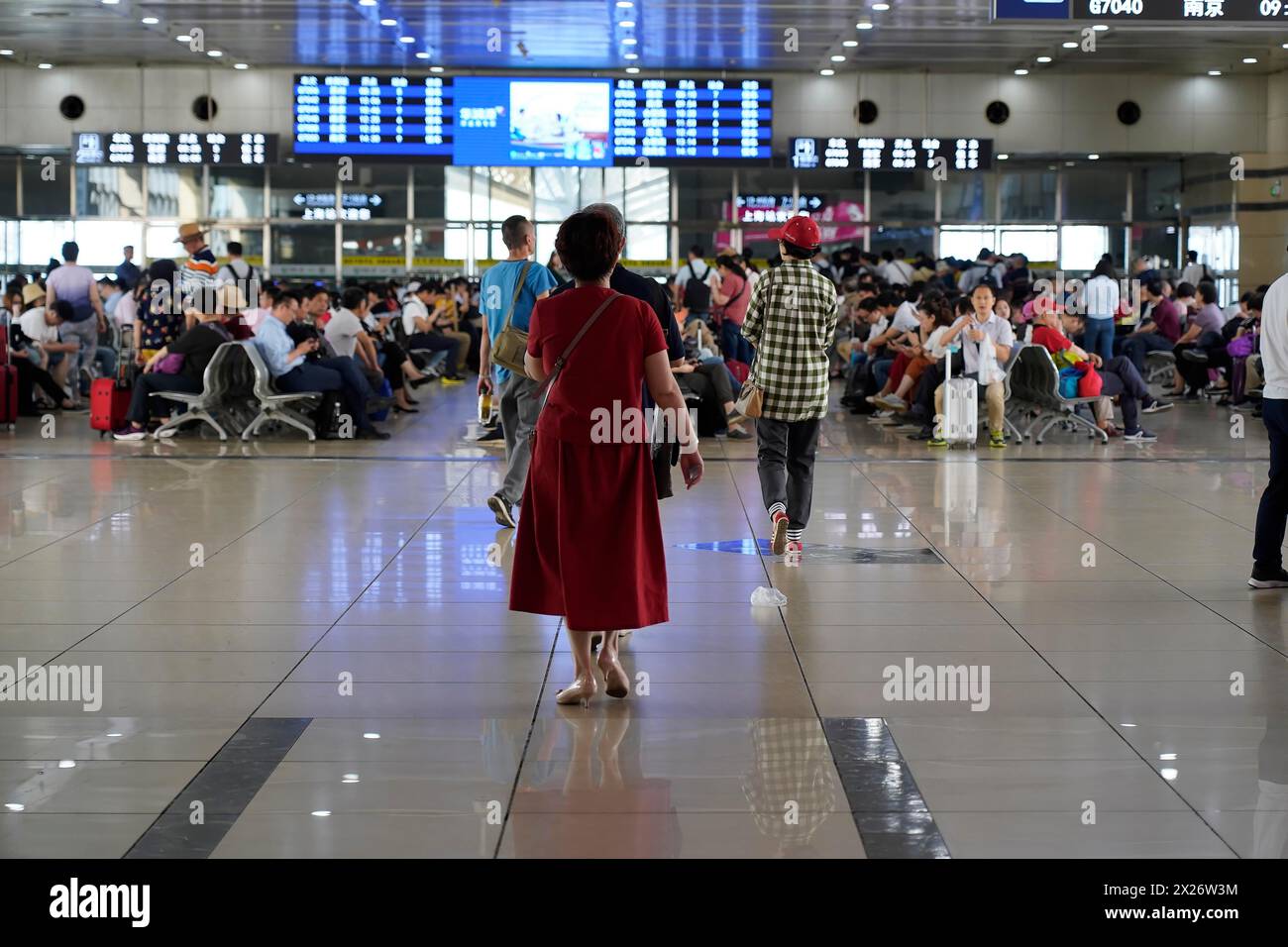 Hongqiao Railway Station, Shanghai, China, Asia, A person in red ...