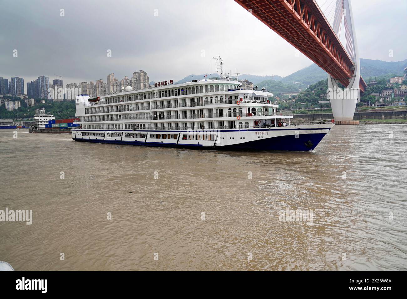 Chongqing, Chongqing Province, China, Cruise ship on a river under a ...