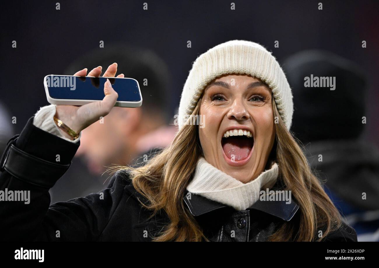 TV presenter Laura Wontorra DAZN, portrait, cap, laughs, waves to her ...