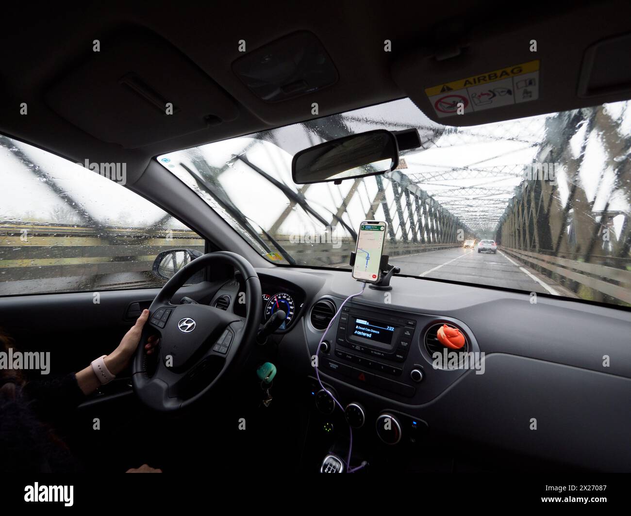 Milan, Italy - April 26th 2023 View from inside a car with a smartphone ...