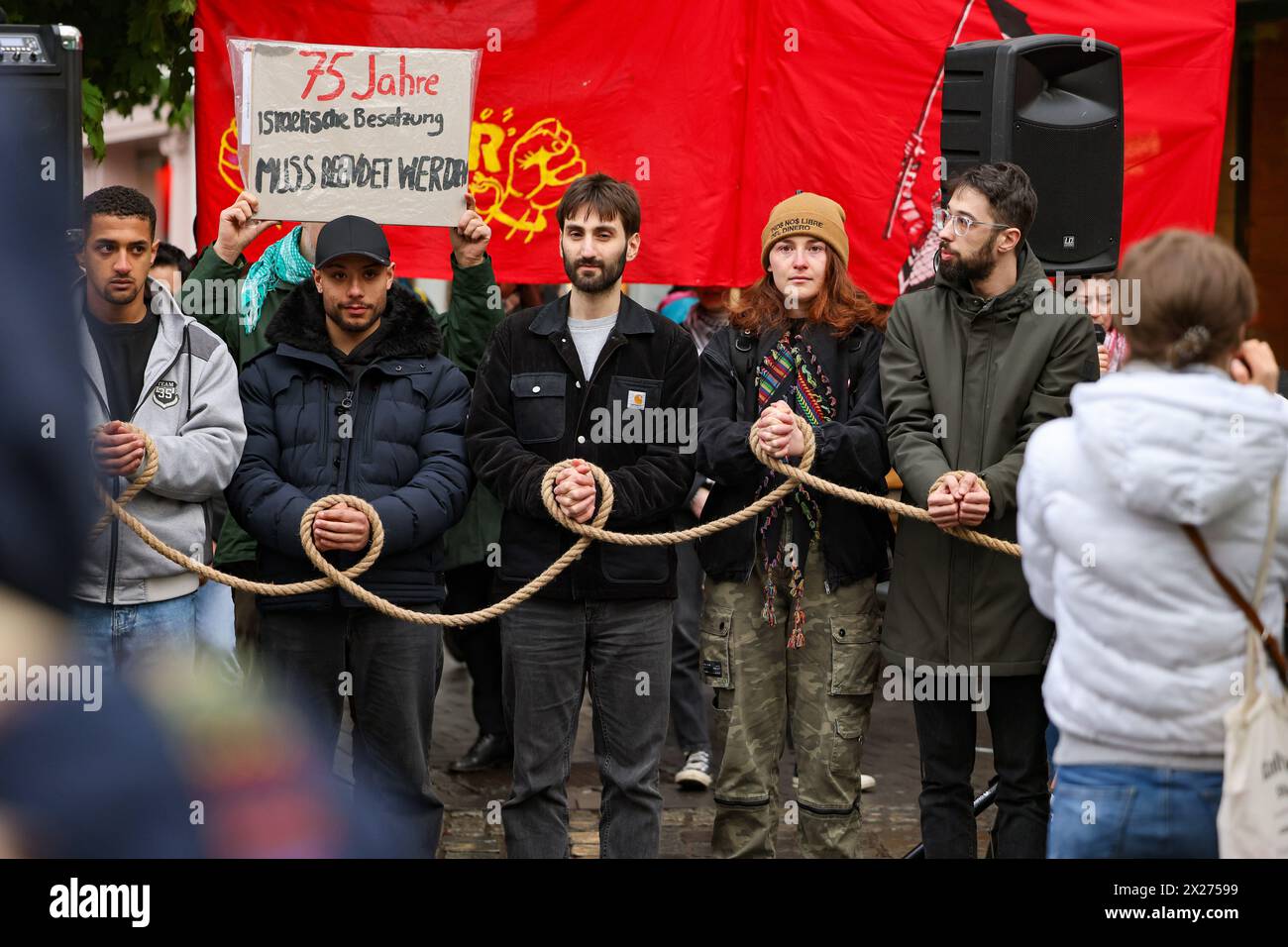 Bonn, Germany. 20th Apr, 2024. Participants symbolically tied ...