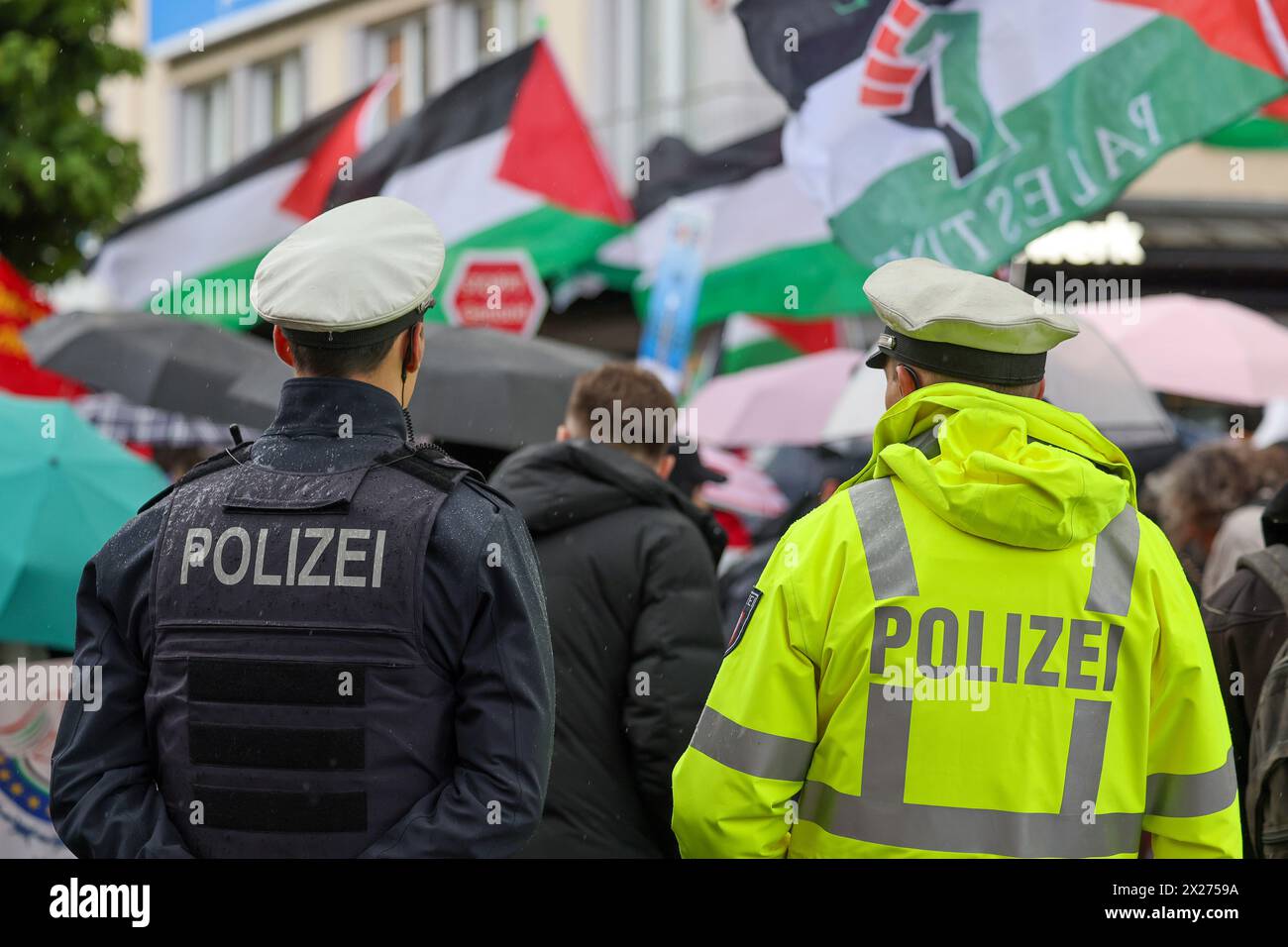 Bonn, Germany. 20th Apr, 2024. Police officers observe events in the ...