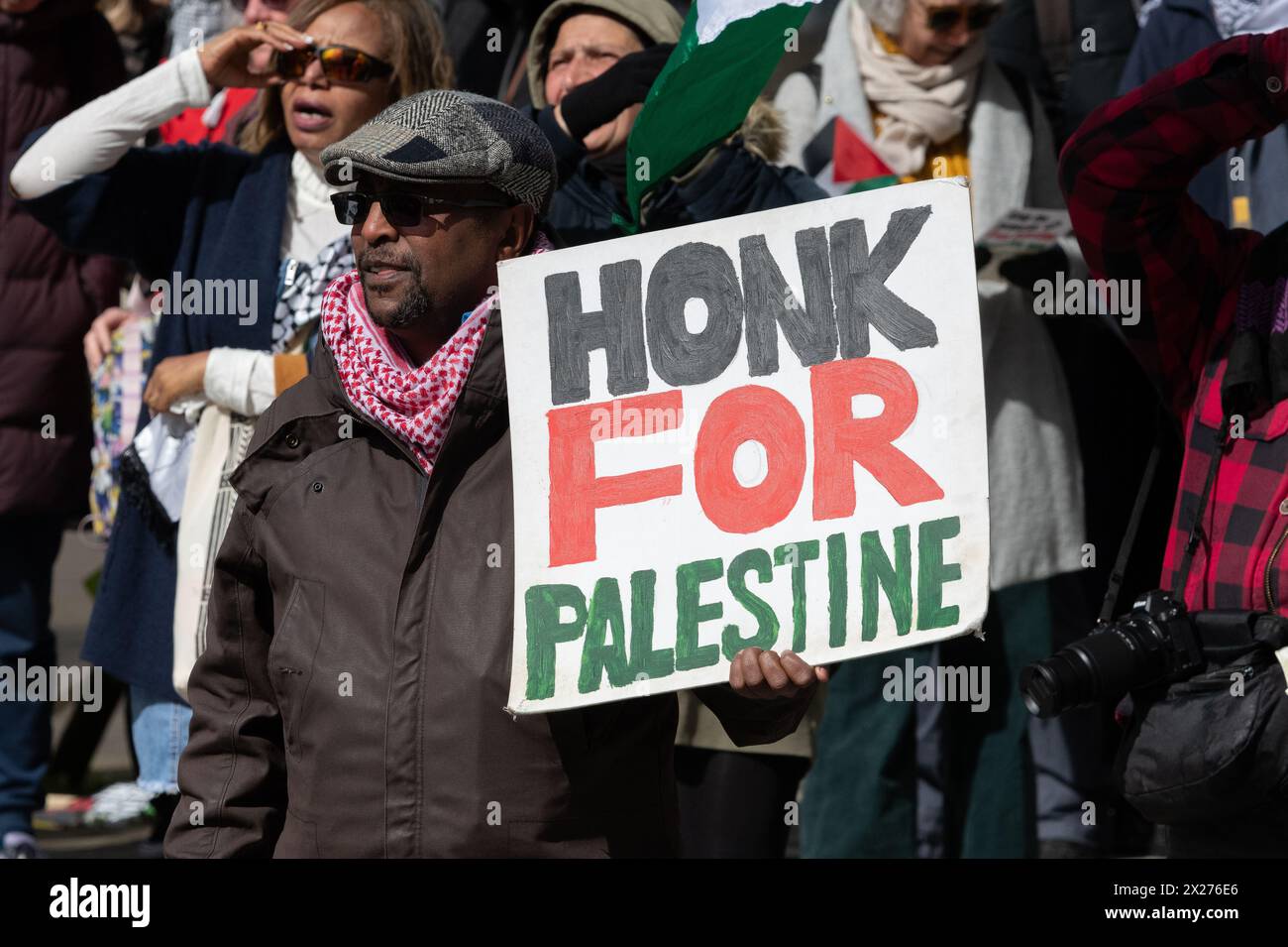 London, UK. 20 April, 2024. A man displays a "Honk For Palestine ...