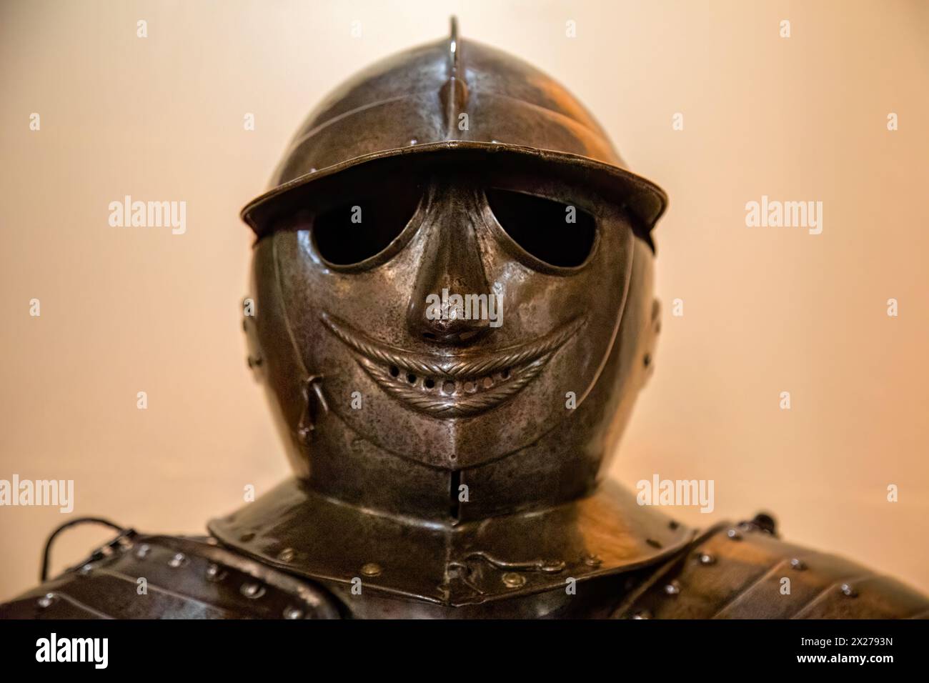 Suits of armer helmets with funny faces Stock Photo - Alamy