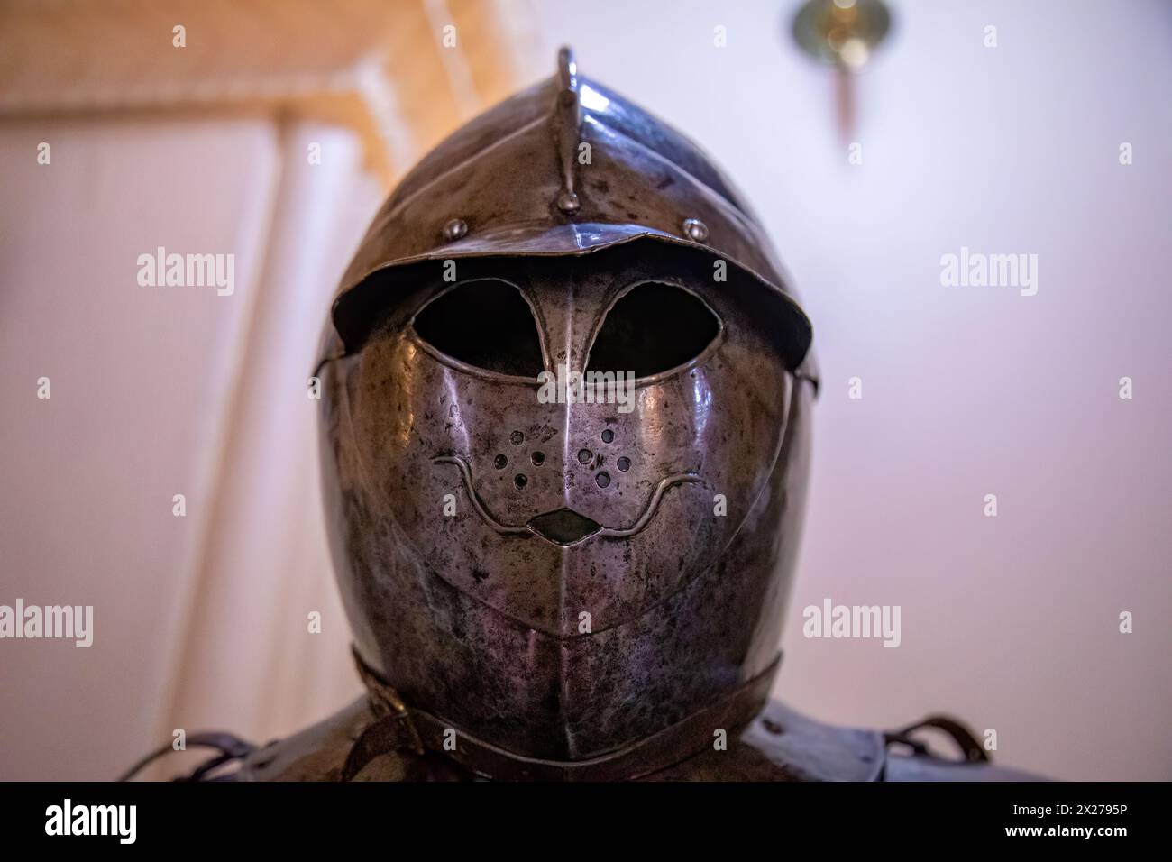 Suits of armer helmets with funny faces Stock Photo - Alamy