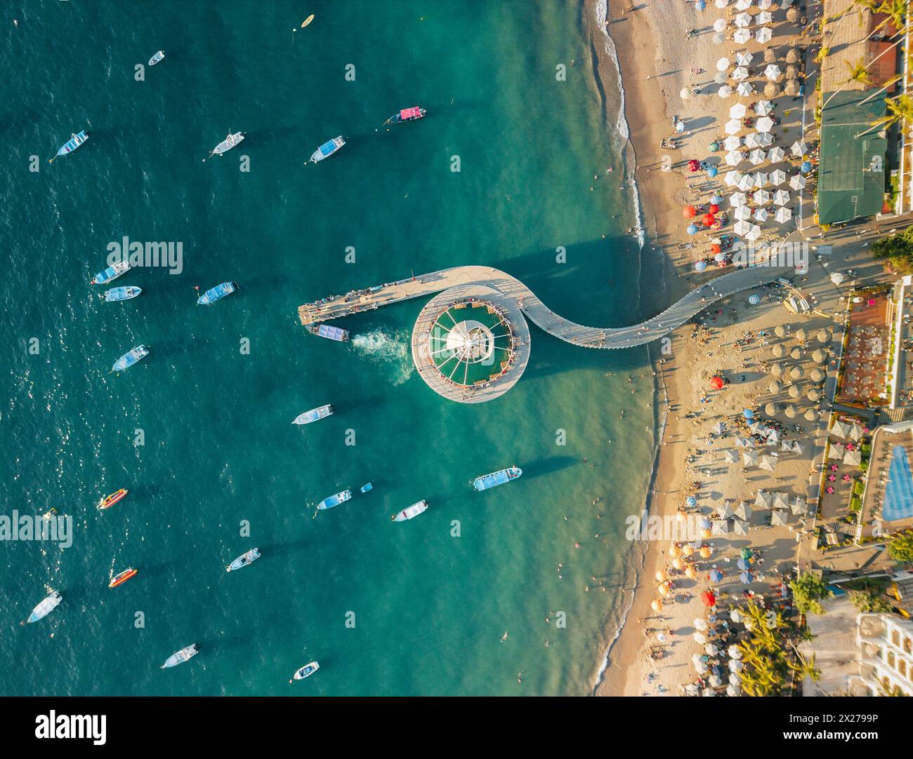 Horizontal aerial view of Los Muertos Pier and hotels at sunset in ...