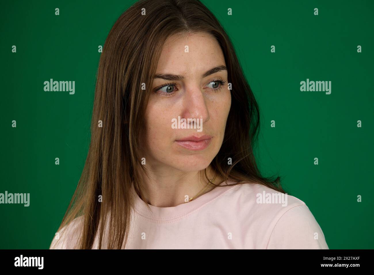 different emotions of a young girl on a green background chromakey ...