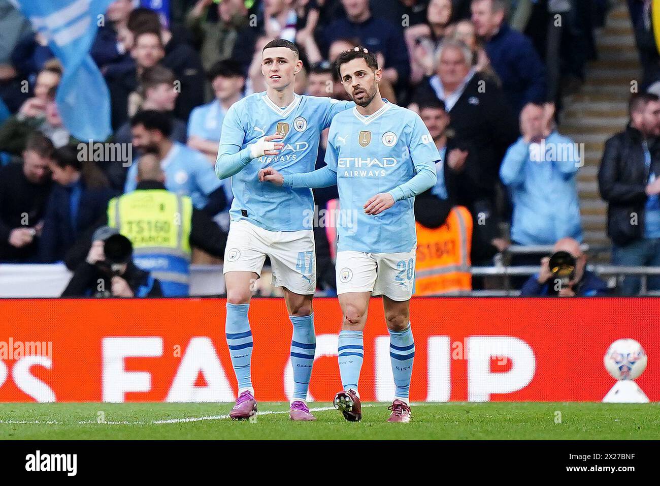 Manchester City's Bernardo Silva (right) celebrates scoring the opening ...