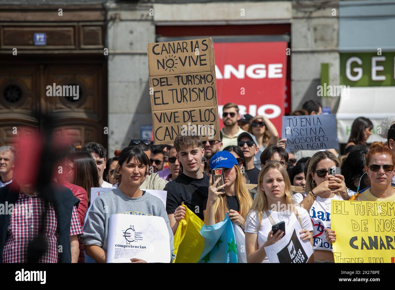 Madrid, Spain. 20th Apr, 2024. A group of protesters hold a flag and ...