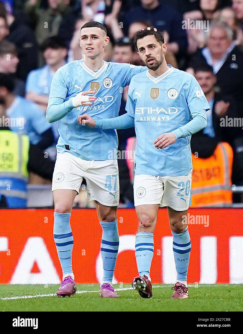 Manchester City's Bernardo Silva (right) celebrates scoring the opening ...