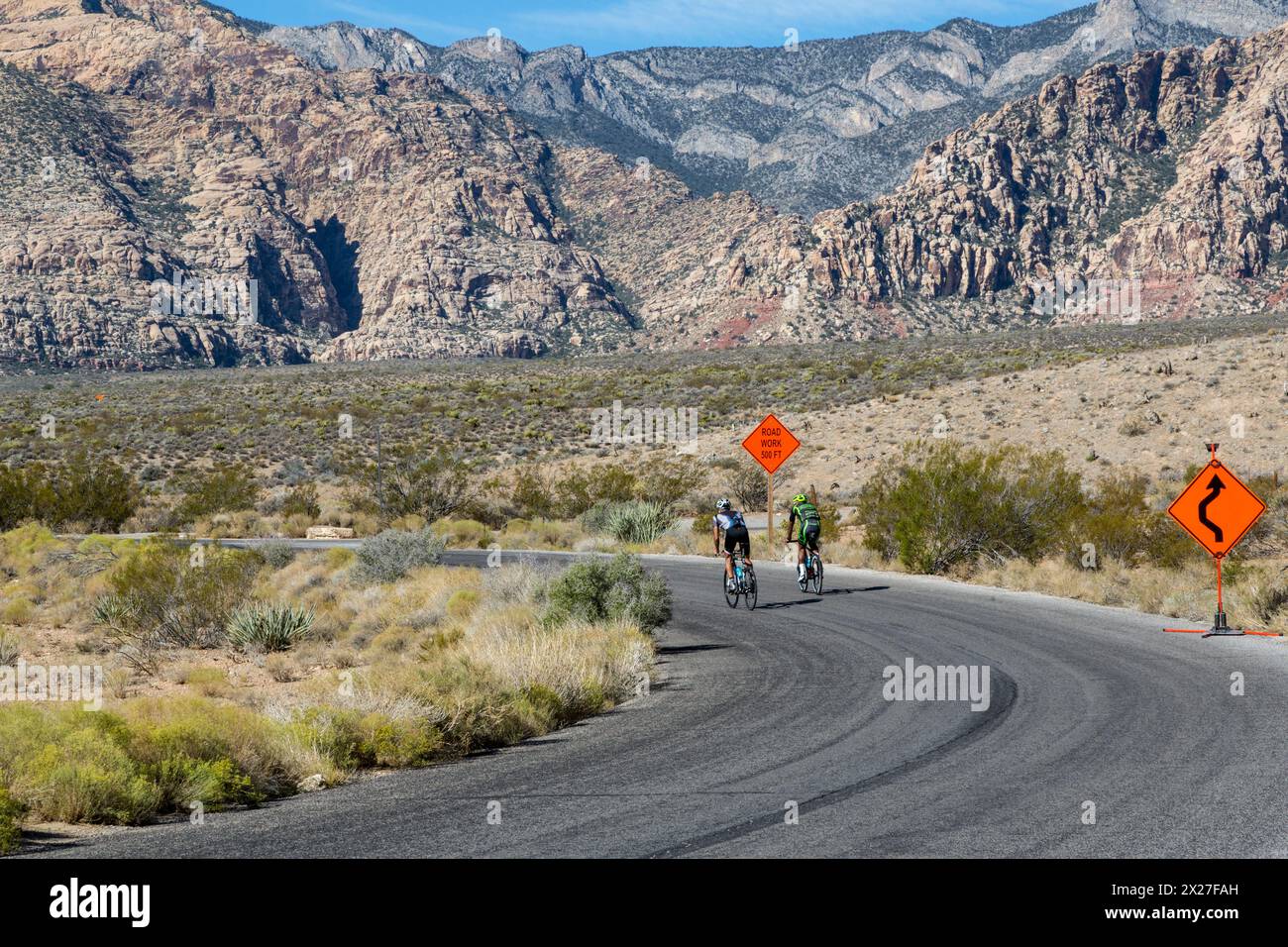 Red Rock Canyon, Nevada. Cyclists on the 17-mile Scenic Drive Stock ...