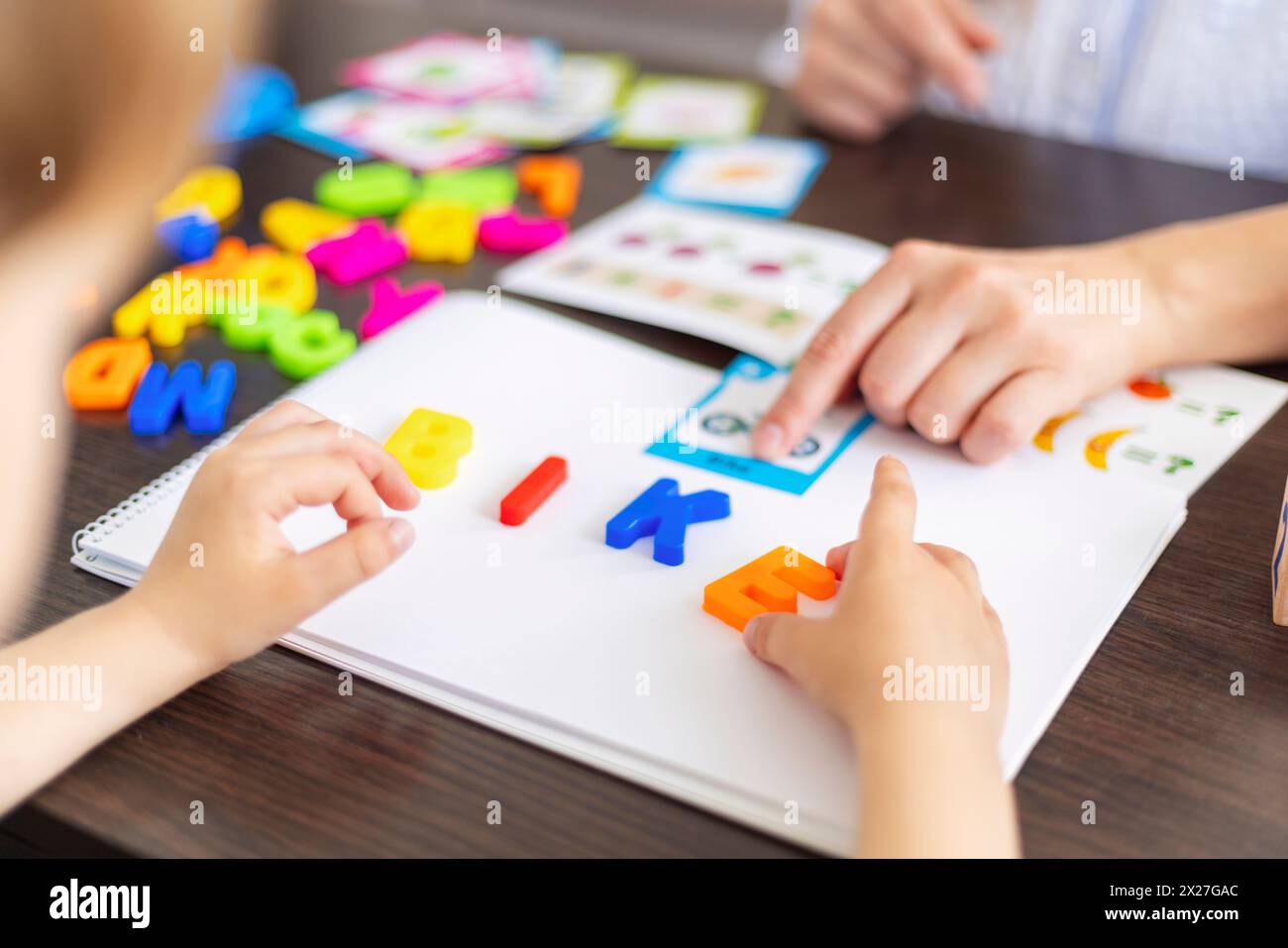 Child Learning Letters with Educational Toys Stock Photo - Alamy