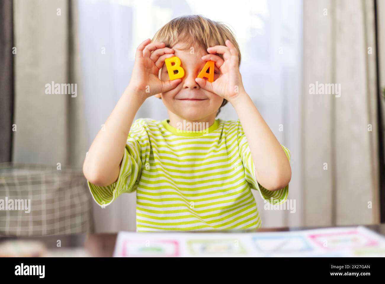 Child Playing with Alphabet Blocks Stock Photo - Alamy