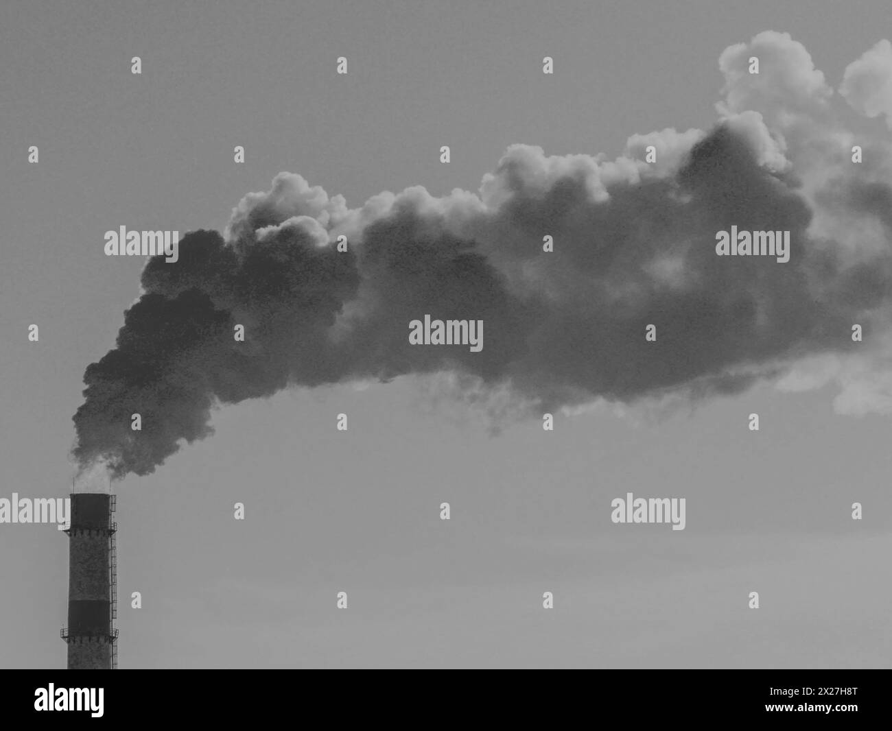 Smoke coming from the chimney heating plant in the background of the ...