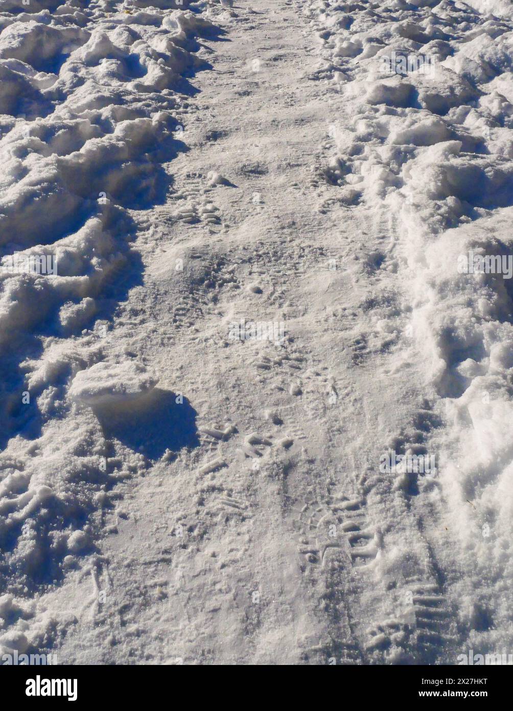 Snow texture with foot prints. Path in the snow in the field with many ...